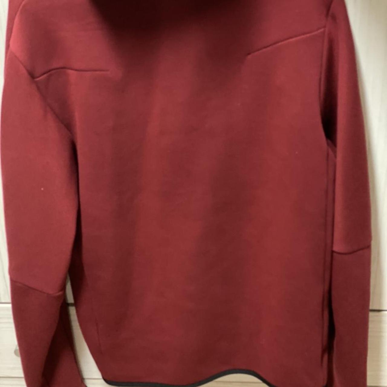 Dark red tech fleece jacket. slightly torn, not... - Depop