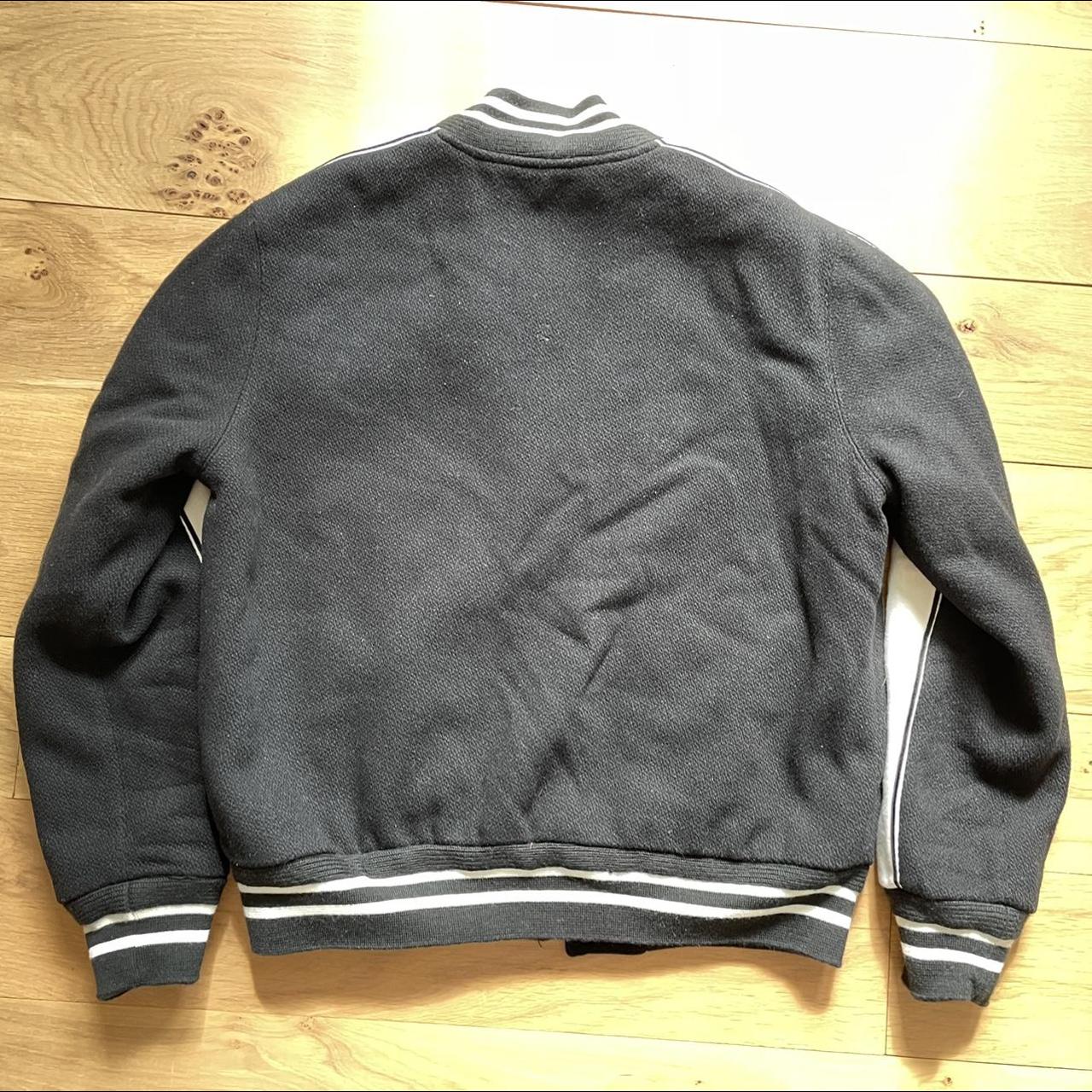Sandro mens Varsity jacket in black and cream. Worn... - Depop