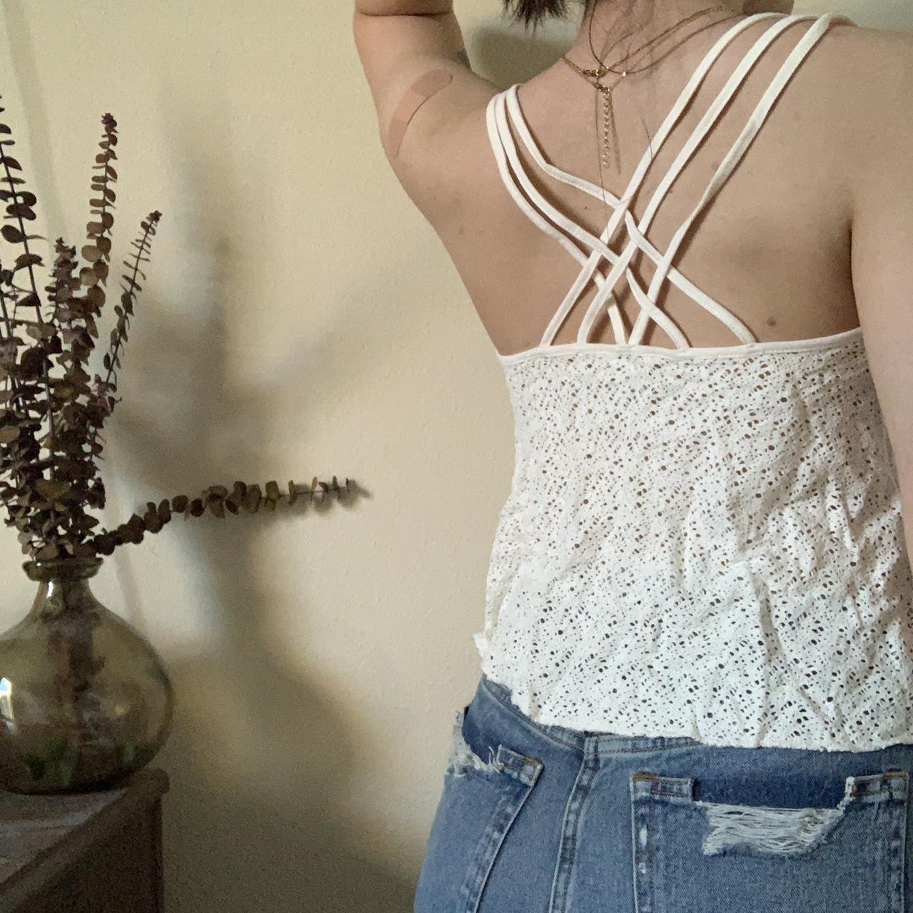 Distressed criss cross open back white top from... - Depop