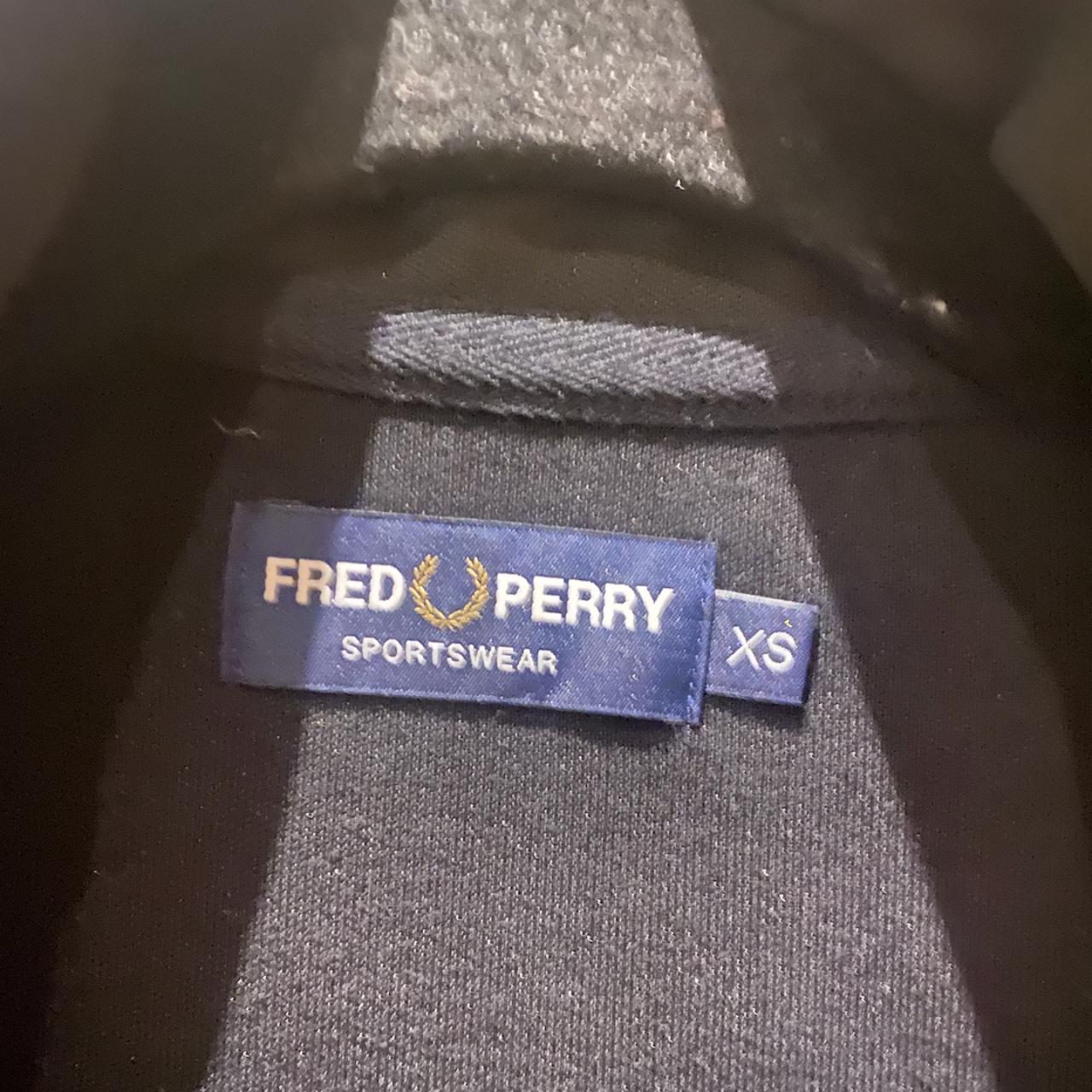 Fred Perry tracksuit top. Black with red and white... - Depop