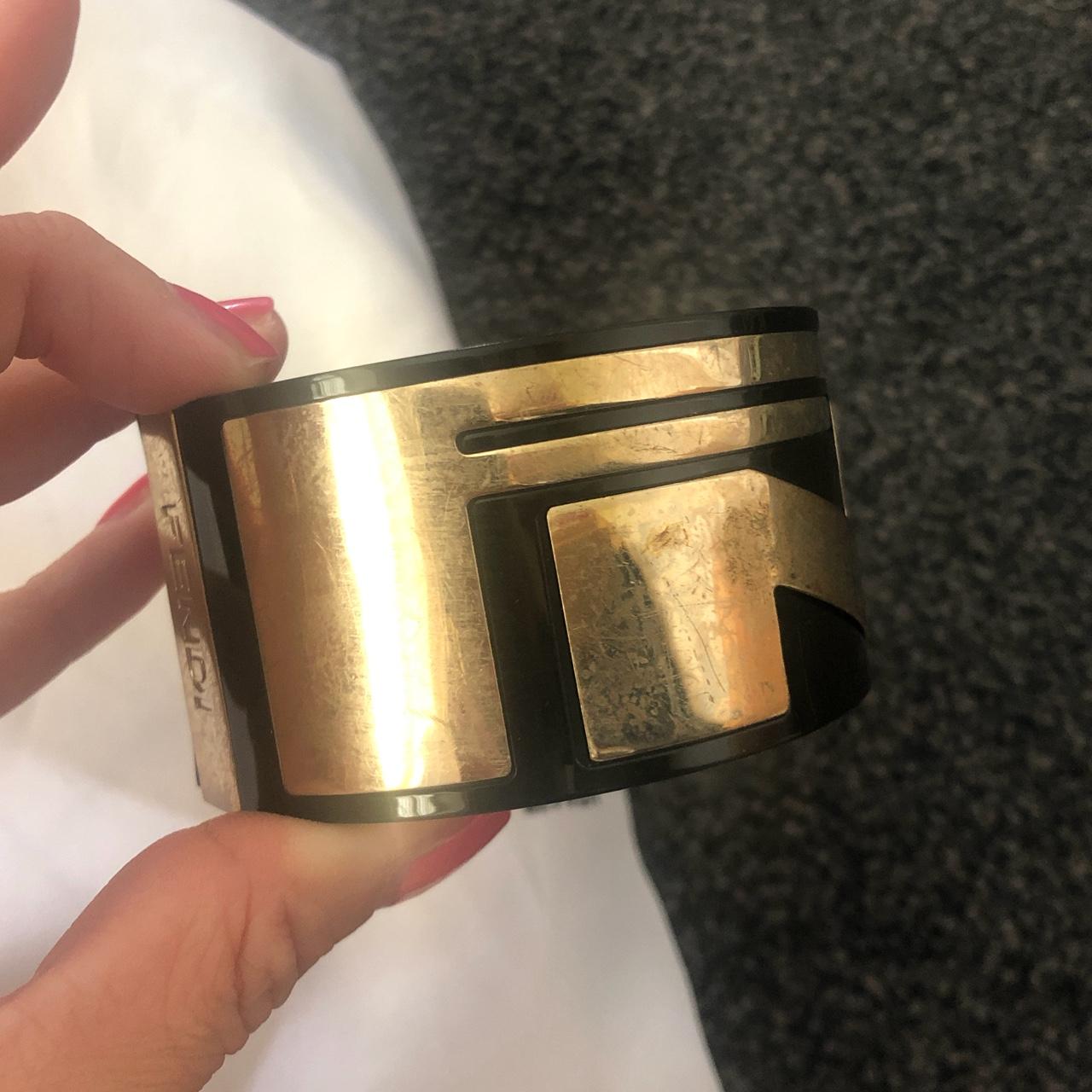 Fendi black and gold bangle Quite scratched as seen... - Depop