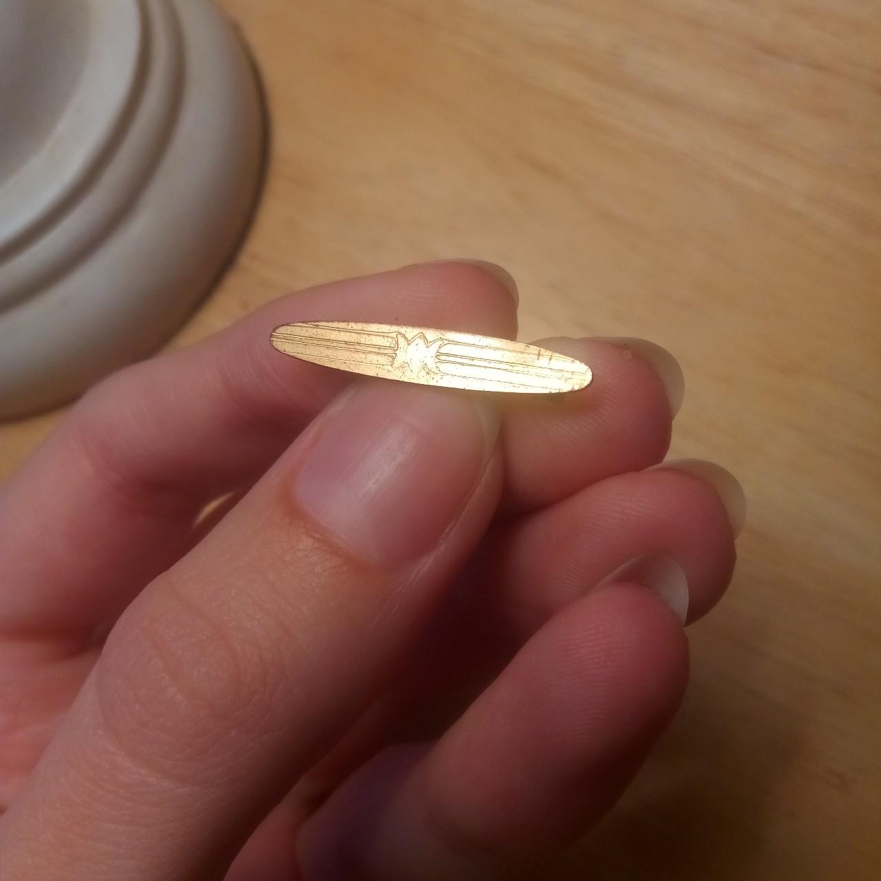 Tiny antique gold toned brass pin with subtle linear... - Depop