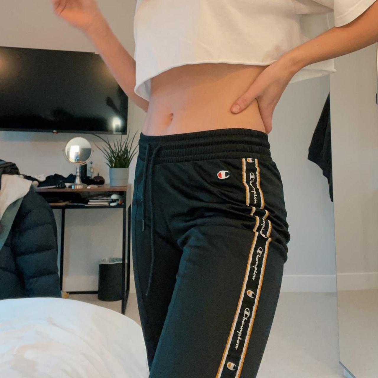 Black Champion trackies with logo down the sides.... - Depop