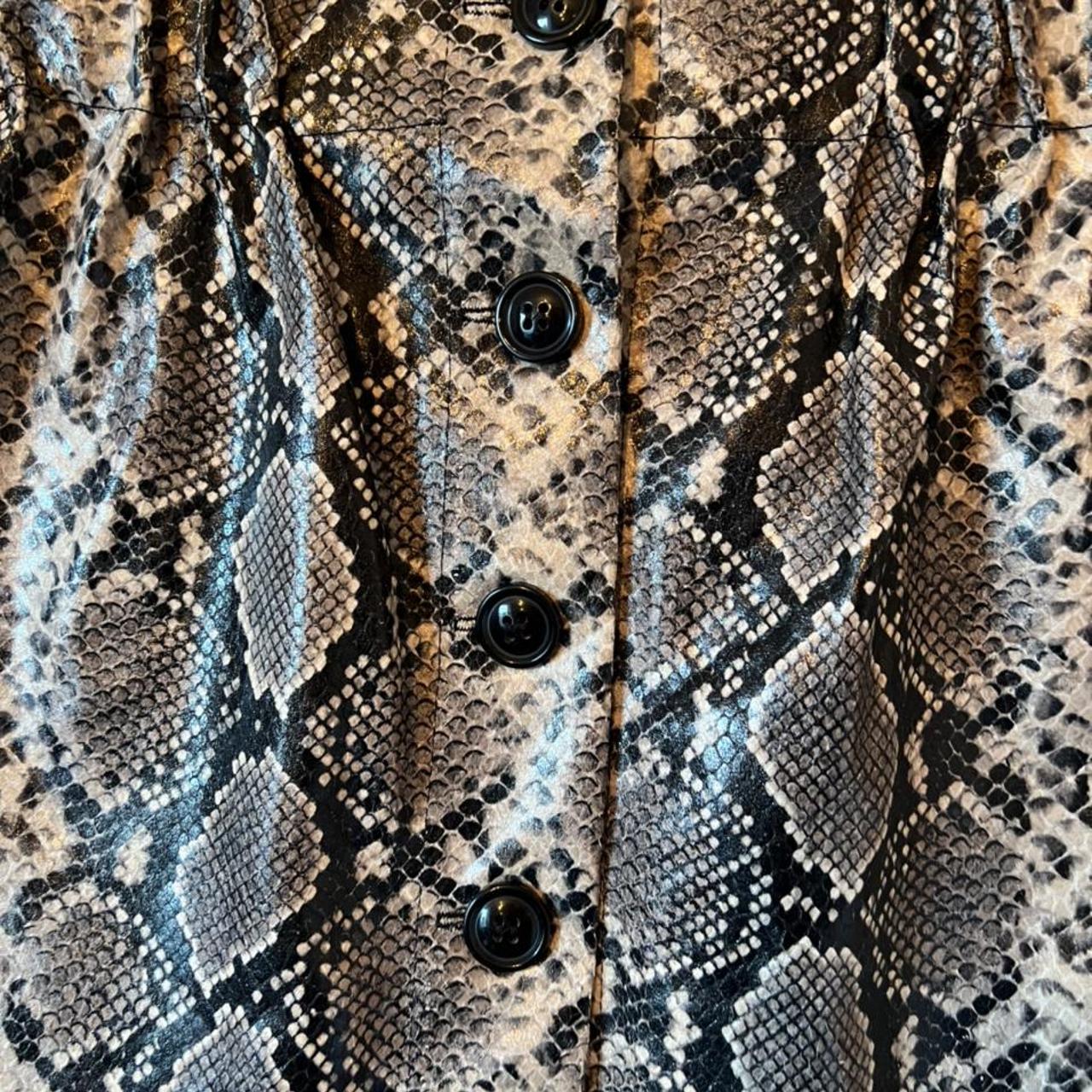 Sara snake print mini skirt with button front detail... - Depop