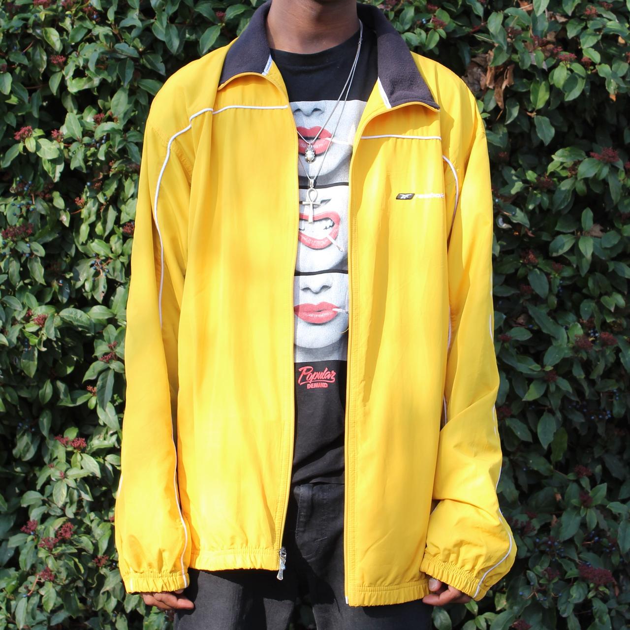 Vintage primary yellow & black Reebok windbreaker... - Depop