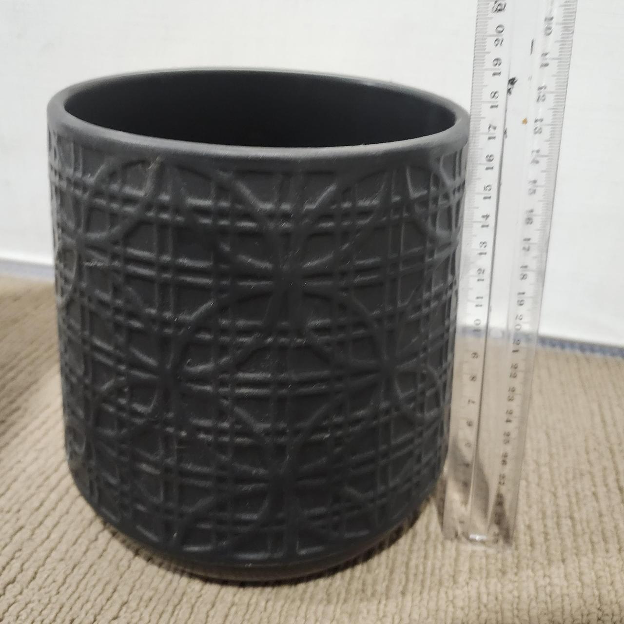 Black textured ceramic plant pot w cute design on... - Depop