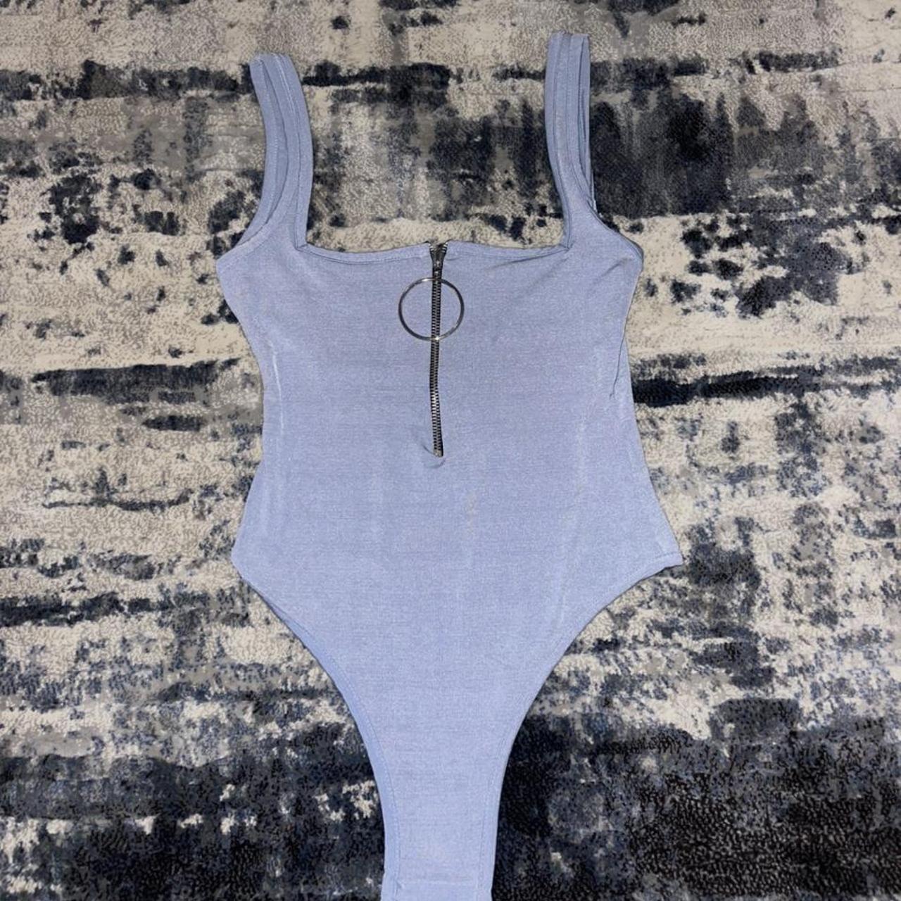 Baby blue zip front bodysuit, size 10, worn once - Depop