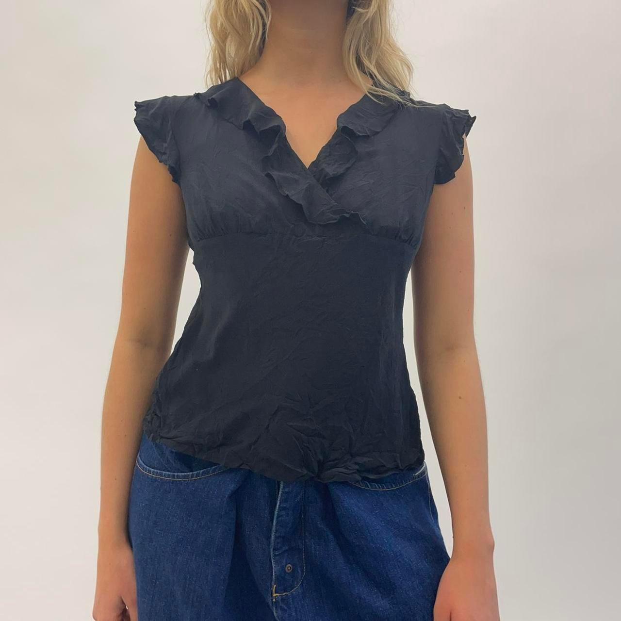 Black ruffle blouse. Wrap cross over at the bust... - Depop
