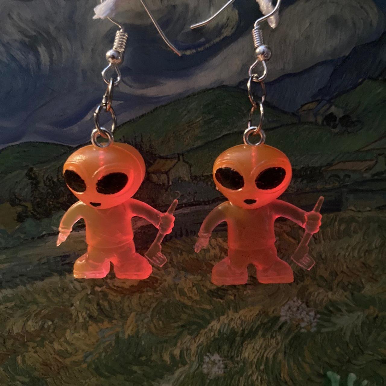 pink hockey playing alien earrings! •... - Depop