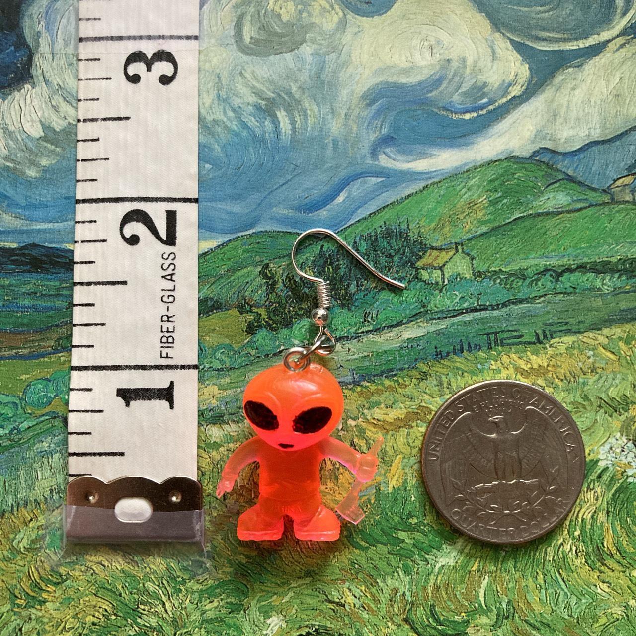 pink hockey playing alien earrings! •... - Depop