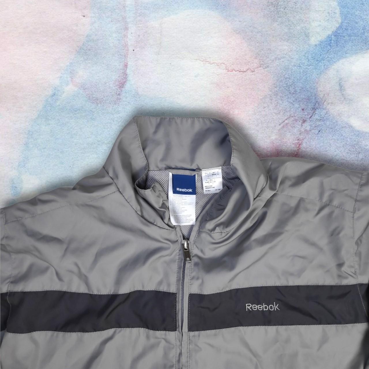 Reebok shell jacket in grey & black Small logo... - Depop