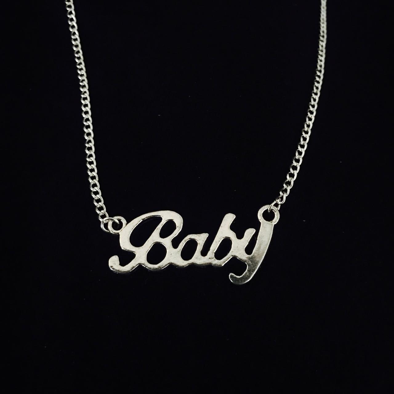 Silver colored baby necklace. #silver #necklace... - Depop