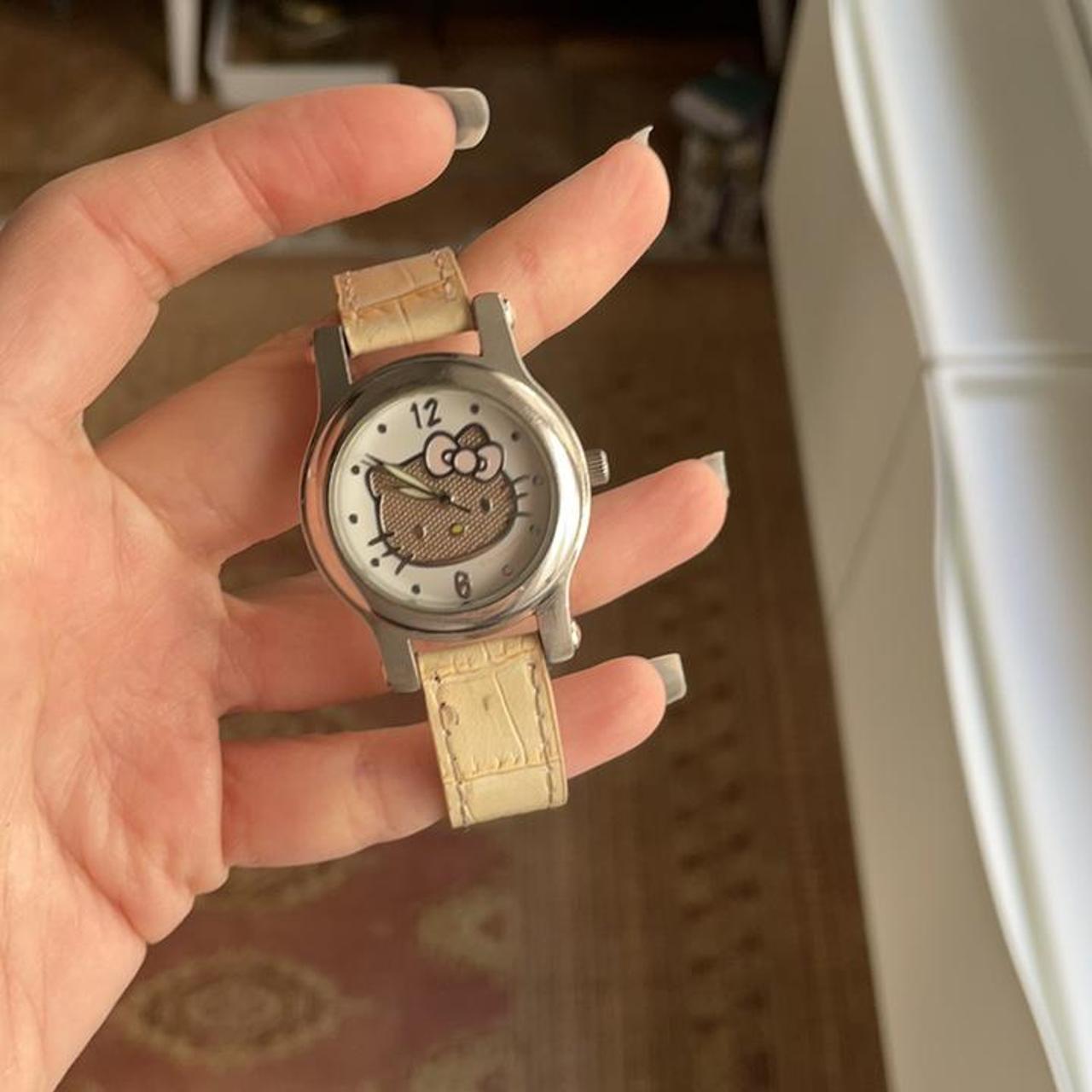 Sanrio Hello Kitty watch - very pale pink/orange and... - Depop