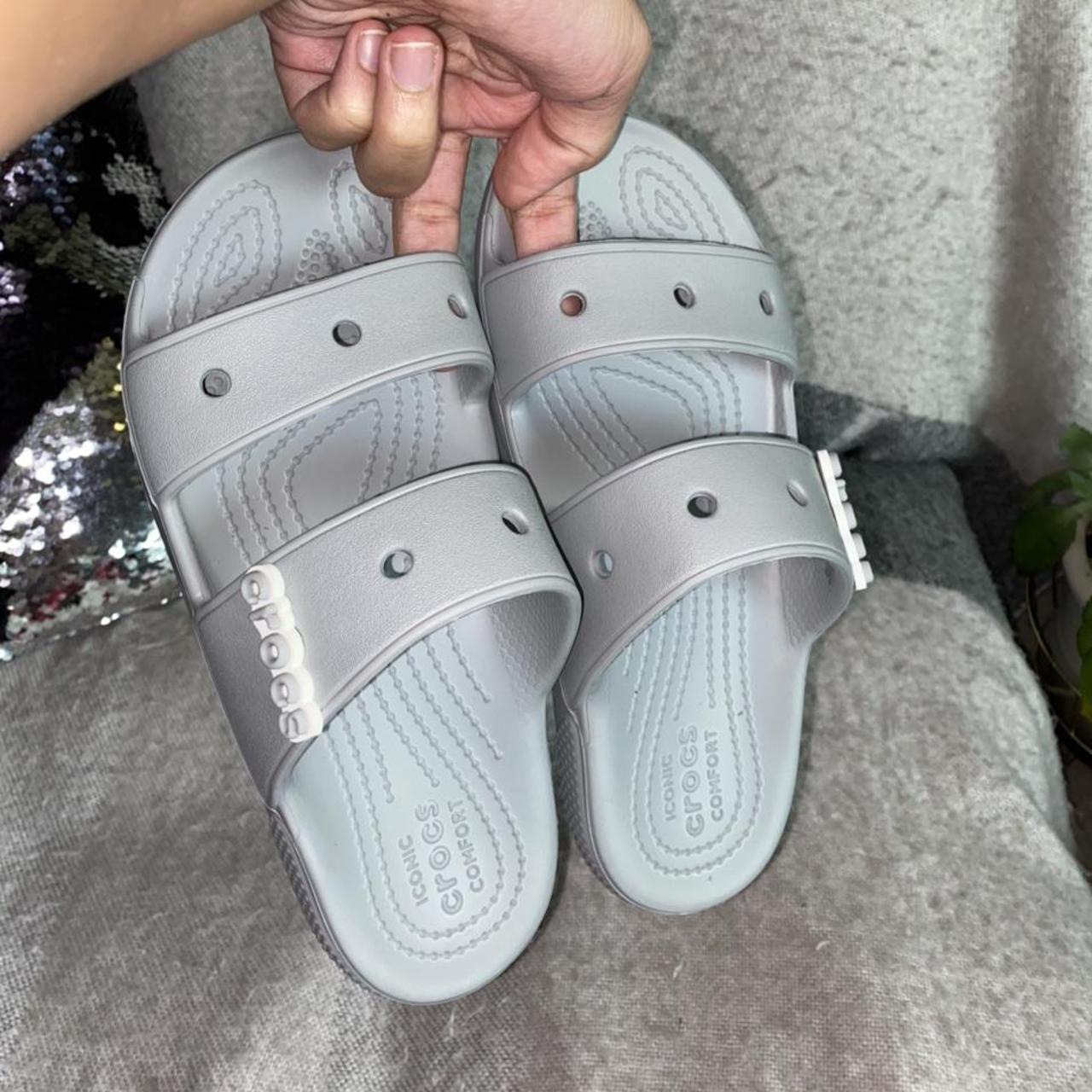 Classic Grey Croc Sandals size is shown in... - Depop