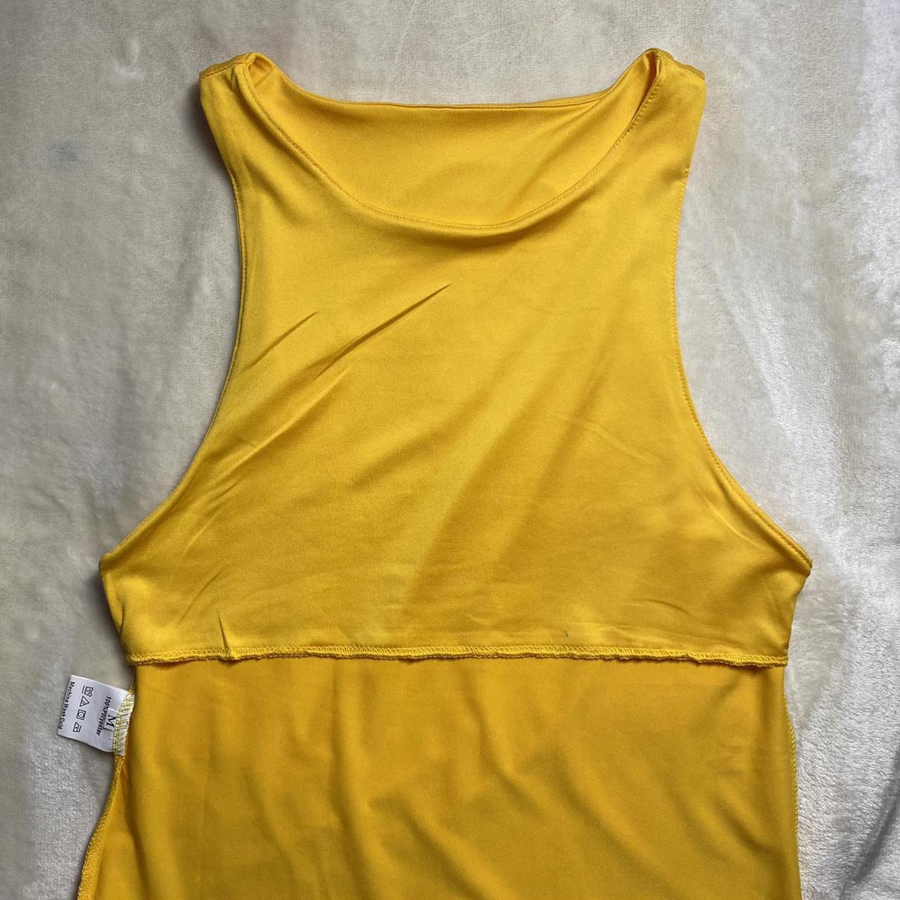 Bright yellow racer back bodysuit. Has lining in... - Depop