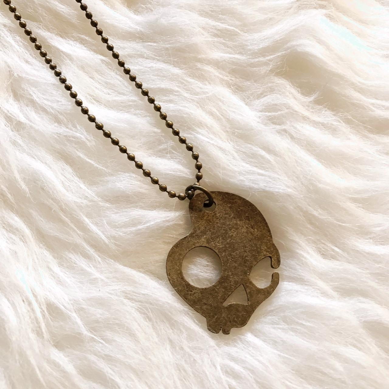 Rare bronze Skullcandy ball chain necklace. Brand... - Depop