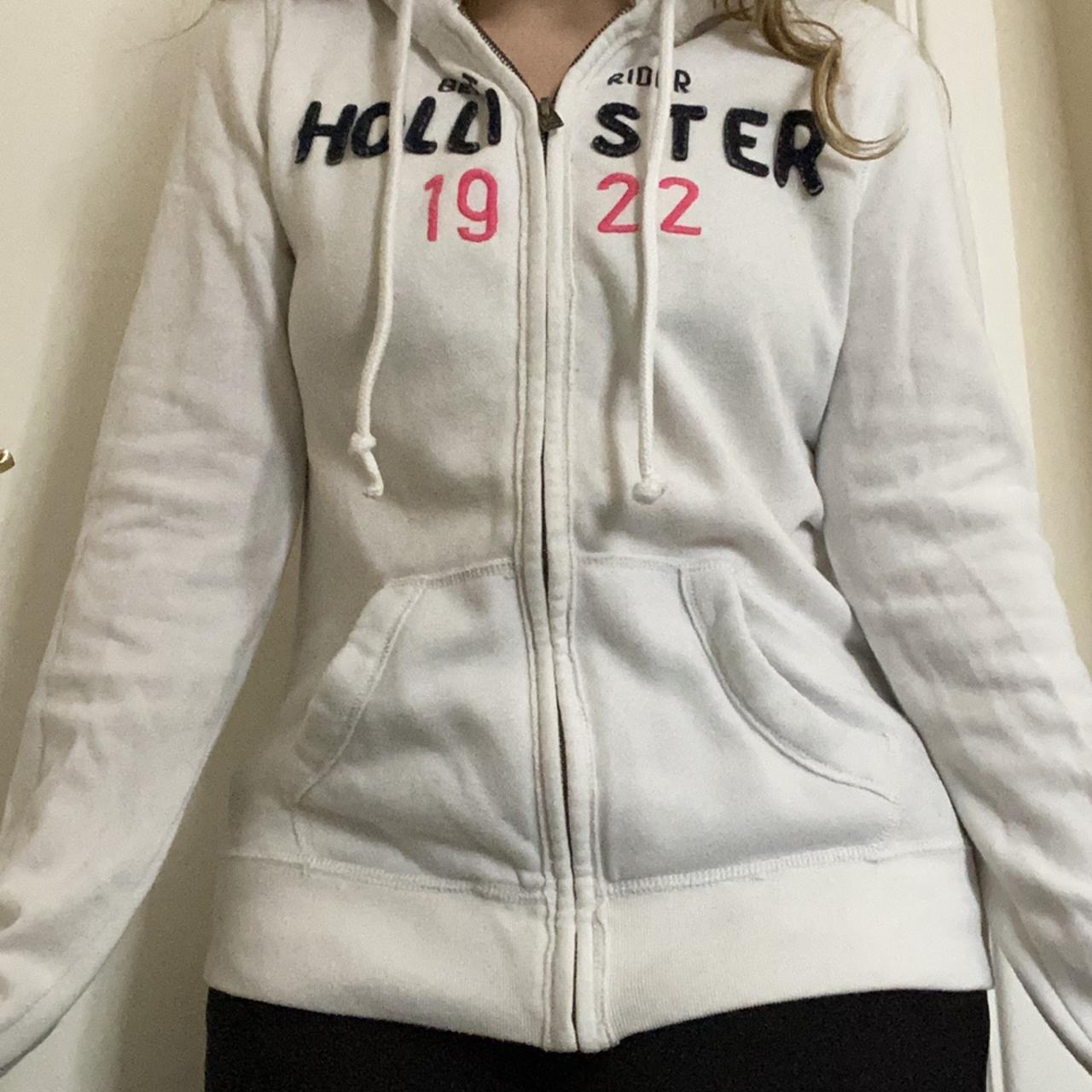Comfiest white Hollister hoodie! Small blue stain on... - Depop