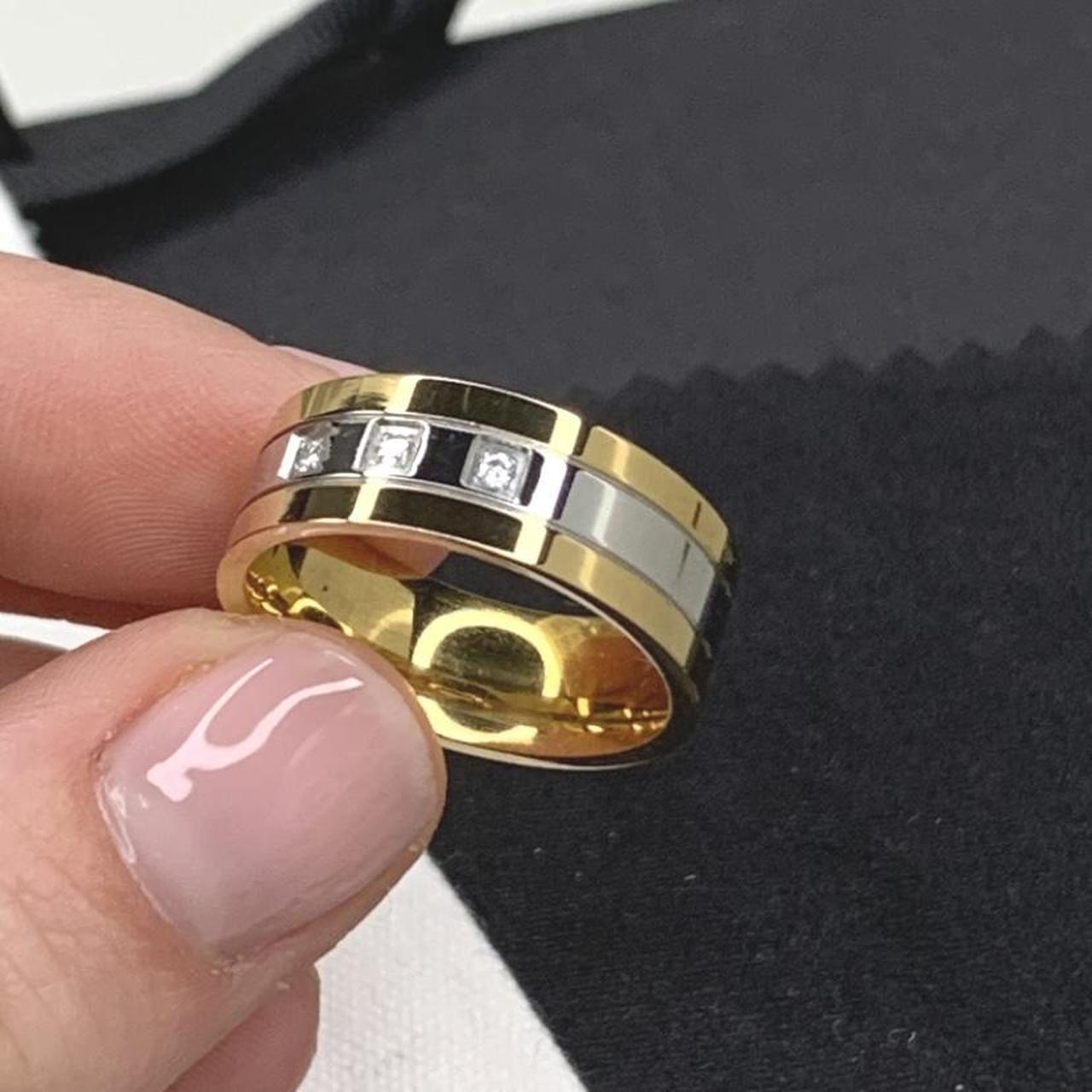 This dual-toned band ring is classy and both an... - Depop