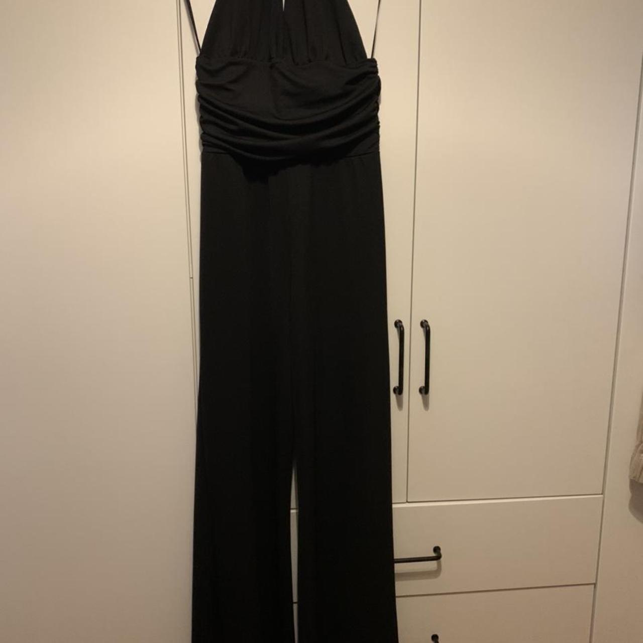 Black halter neck jumpsuit. Ideal for nights out or... - Depop