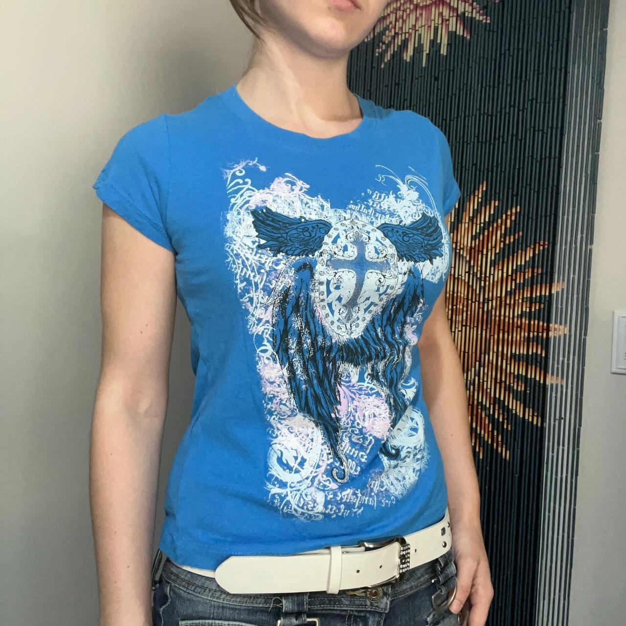 vintage 2000s mcbling graphic top. light blue in... - Depop