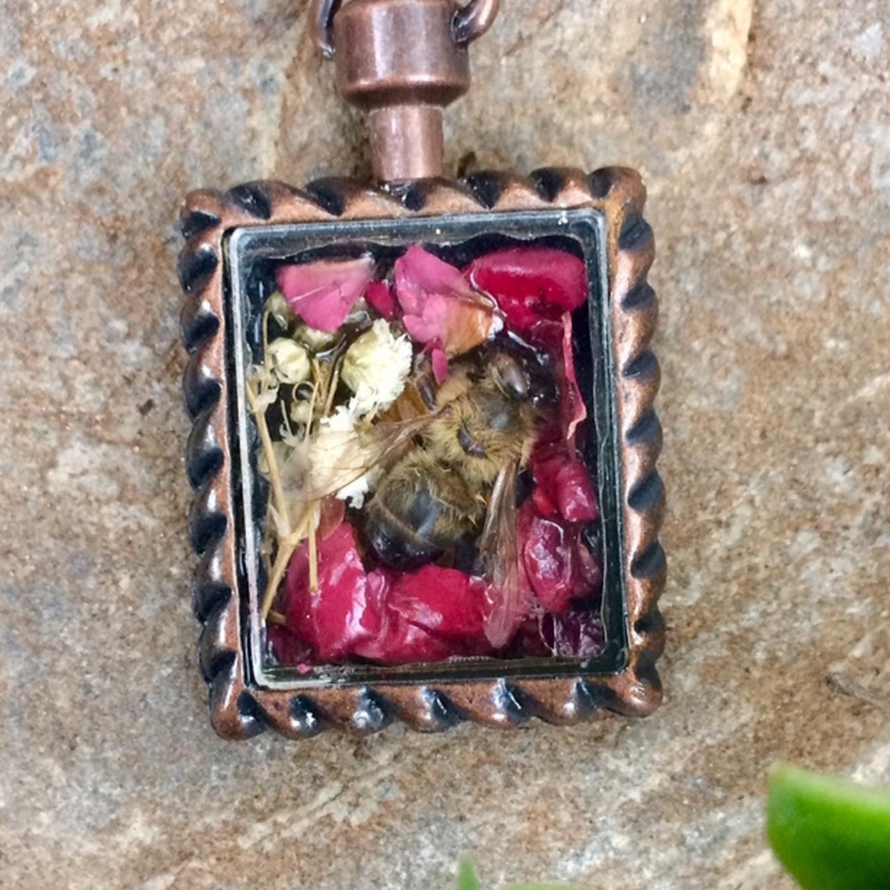 Small locket pendant with bee and dried flowers... - Depop