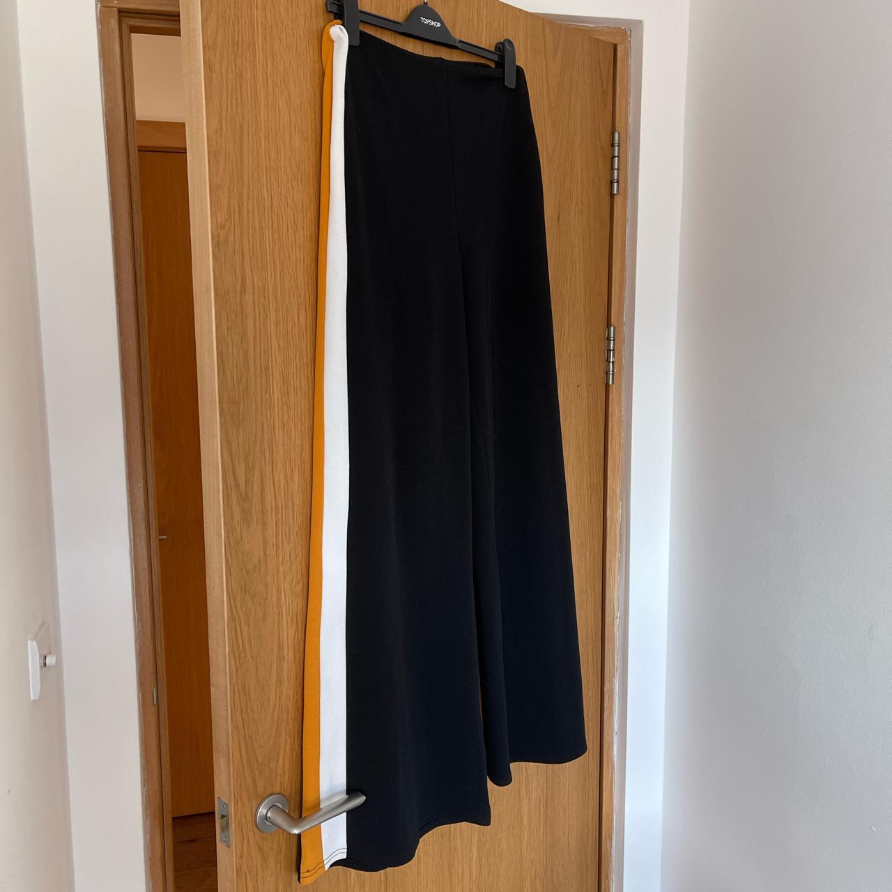 PLT flare trousers - black with orange and white... - Depop