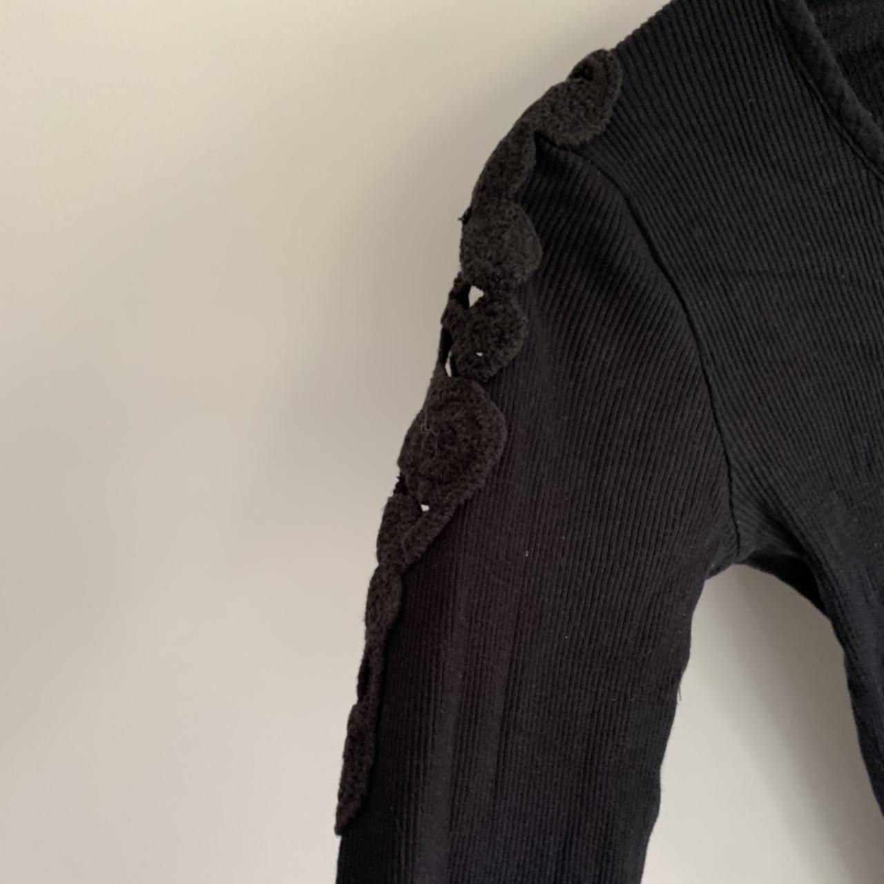 Black long sleeve ribbed top with detail on the... - Depop