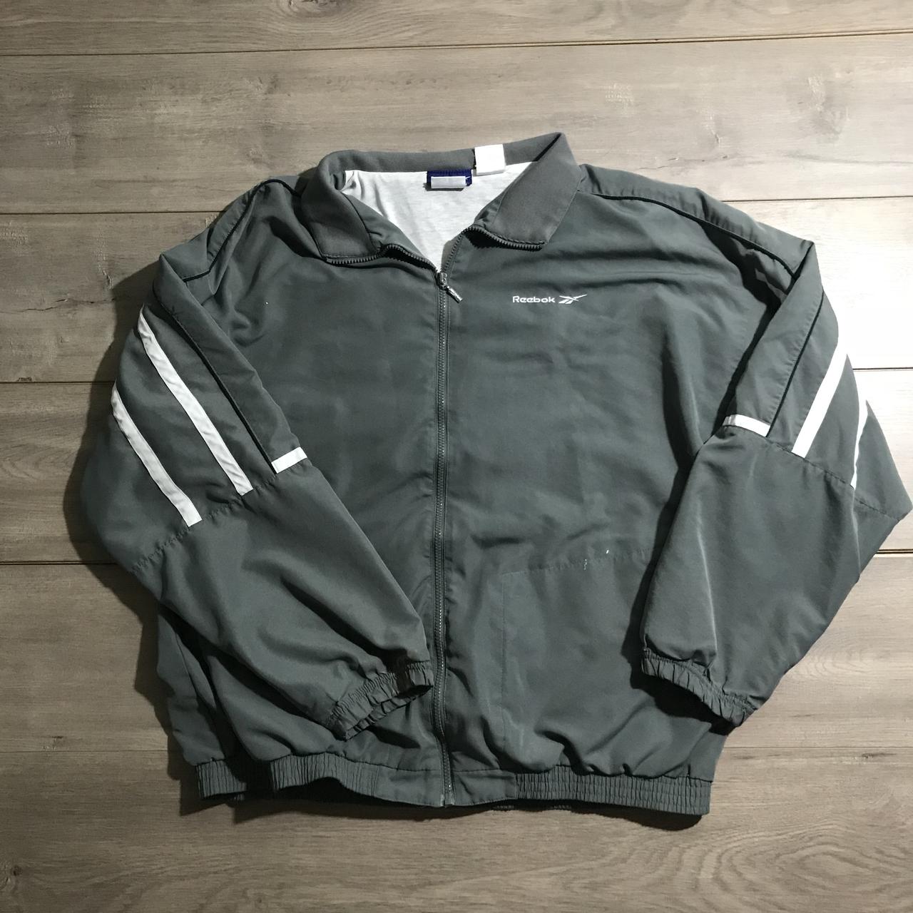 Vintage Reebok jacket classic design with some wear... - Depop