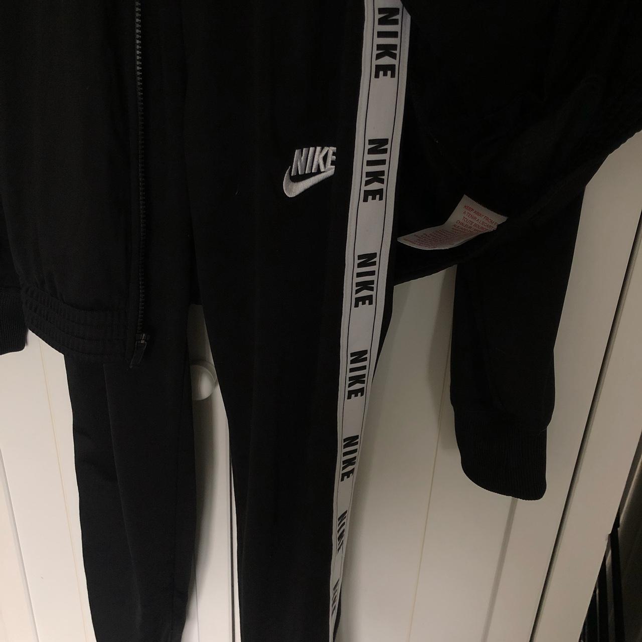 Nike Tracksuit in Black with sleeve and leg detail -... - Depop