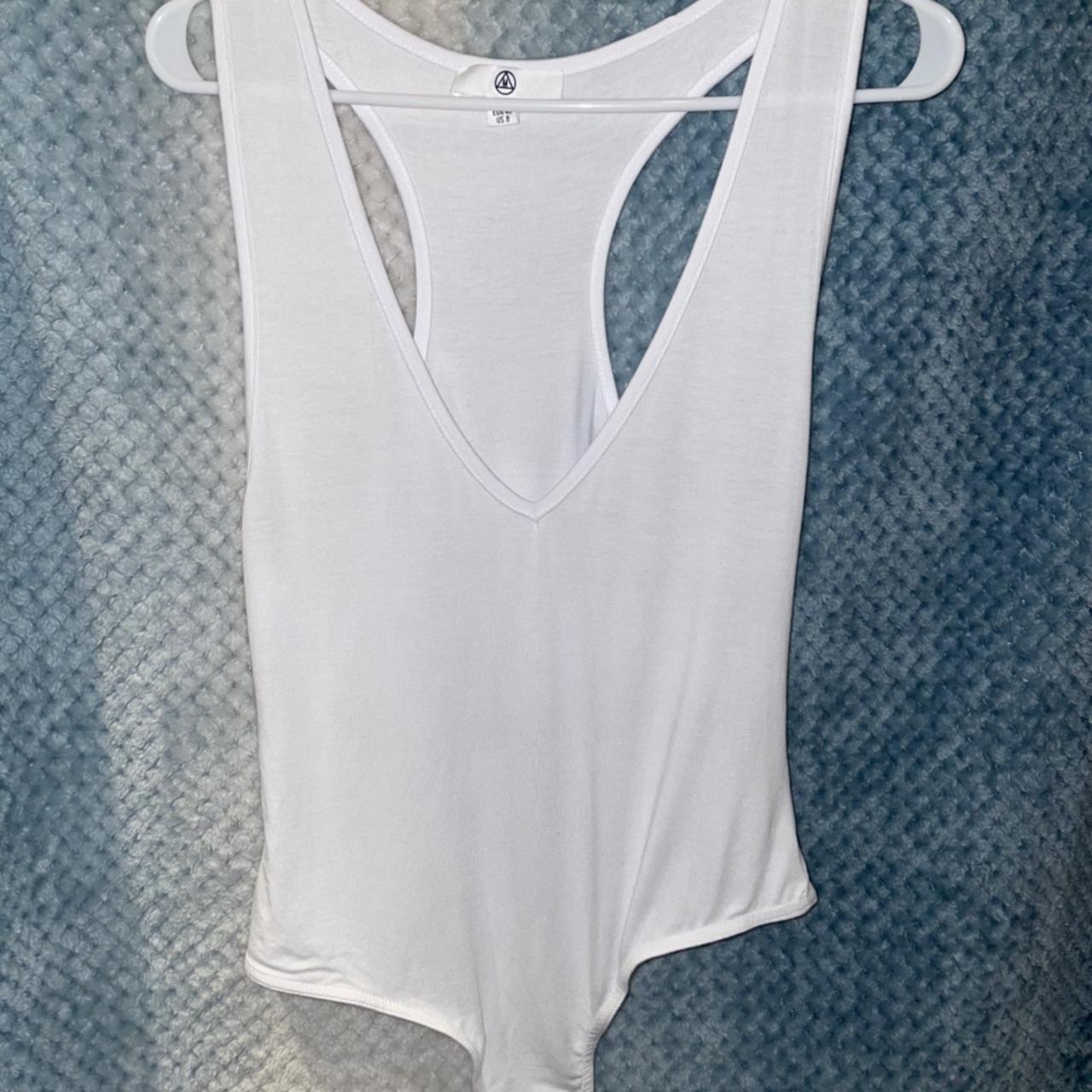 White halter neck bodysuit with plunge neckline... - Depop