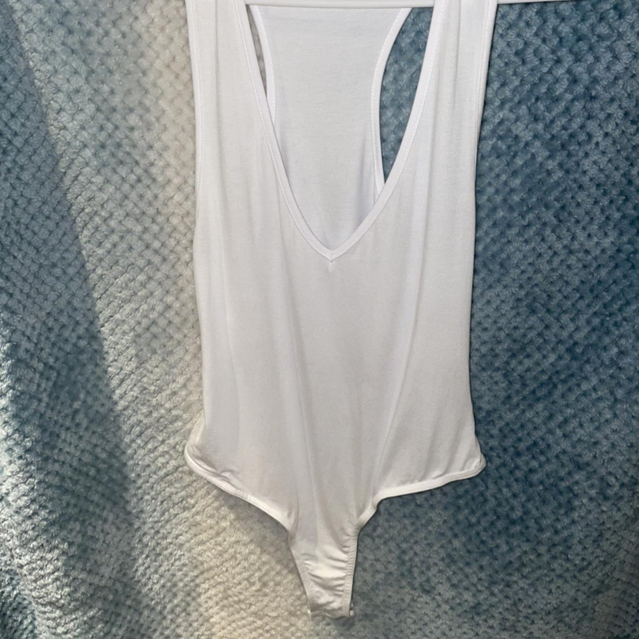 White halter neck bodysuit with plunge neckline... - Depop