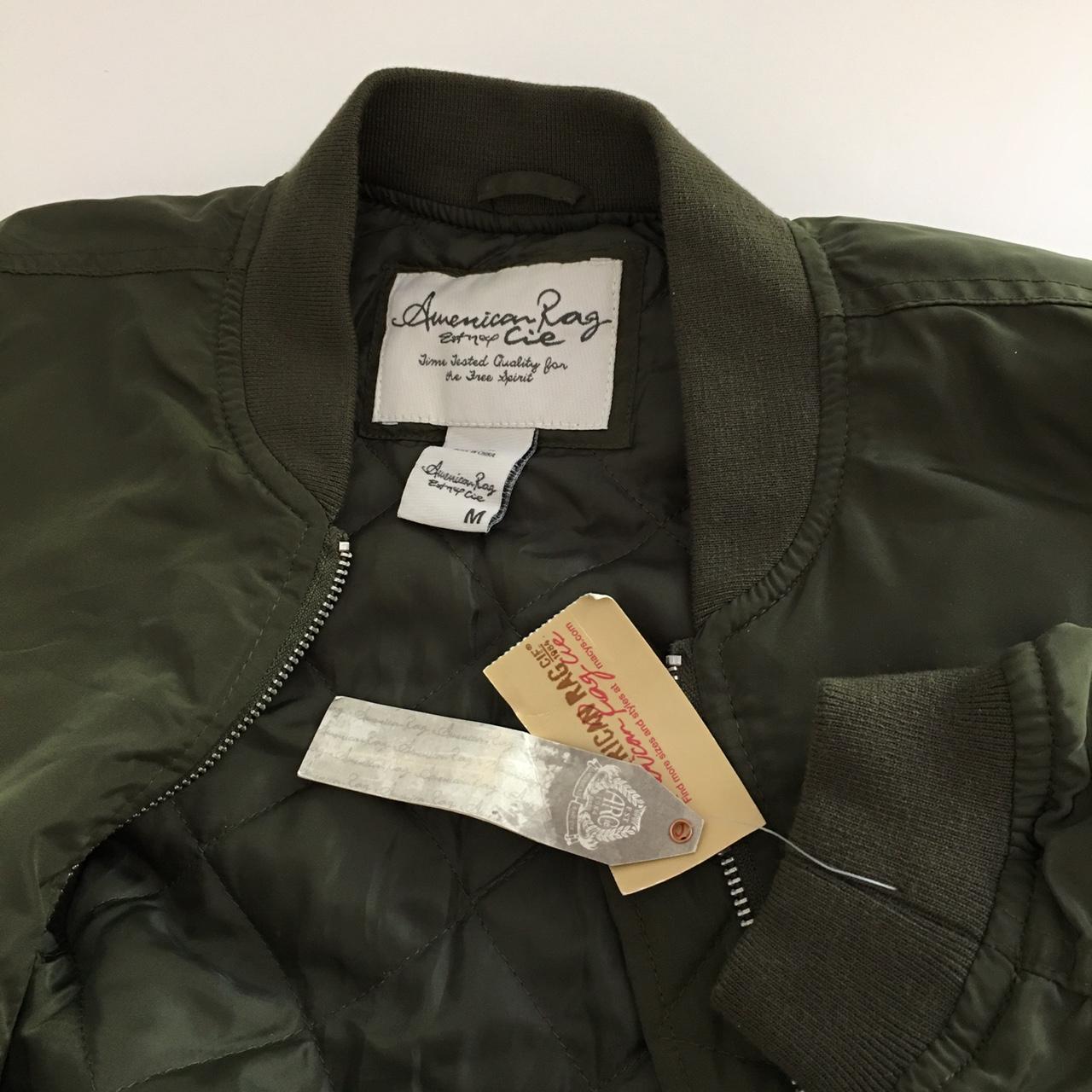 American Rag, green bomber jacket. Never worn, still... - Depop