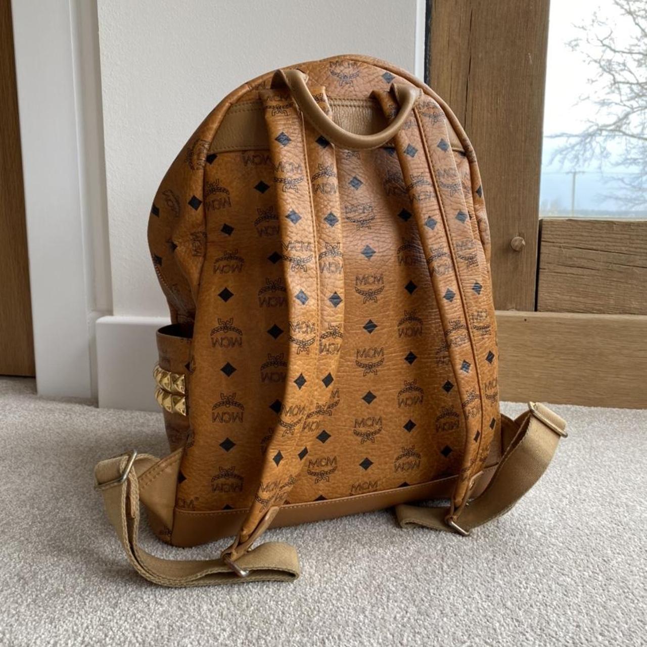 MCM backpack/rucksack with gold hardware and studded... - Depop