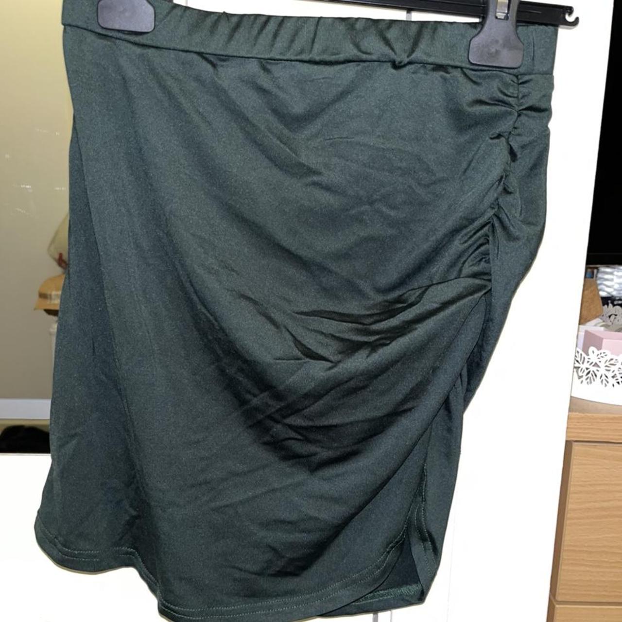 Women’s forest green mini skirt with a ruched side... - Depop
