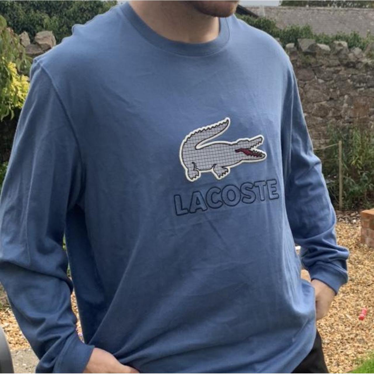 Blue black cross pattern Lacoste big logo spellout... - Depop