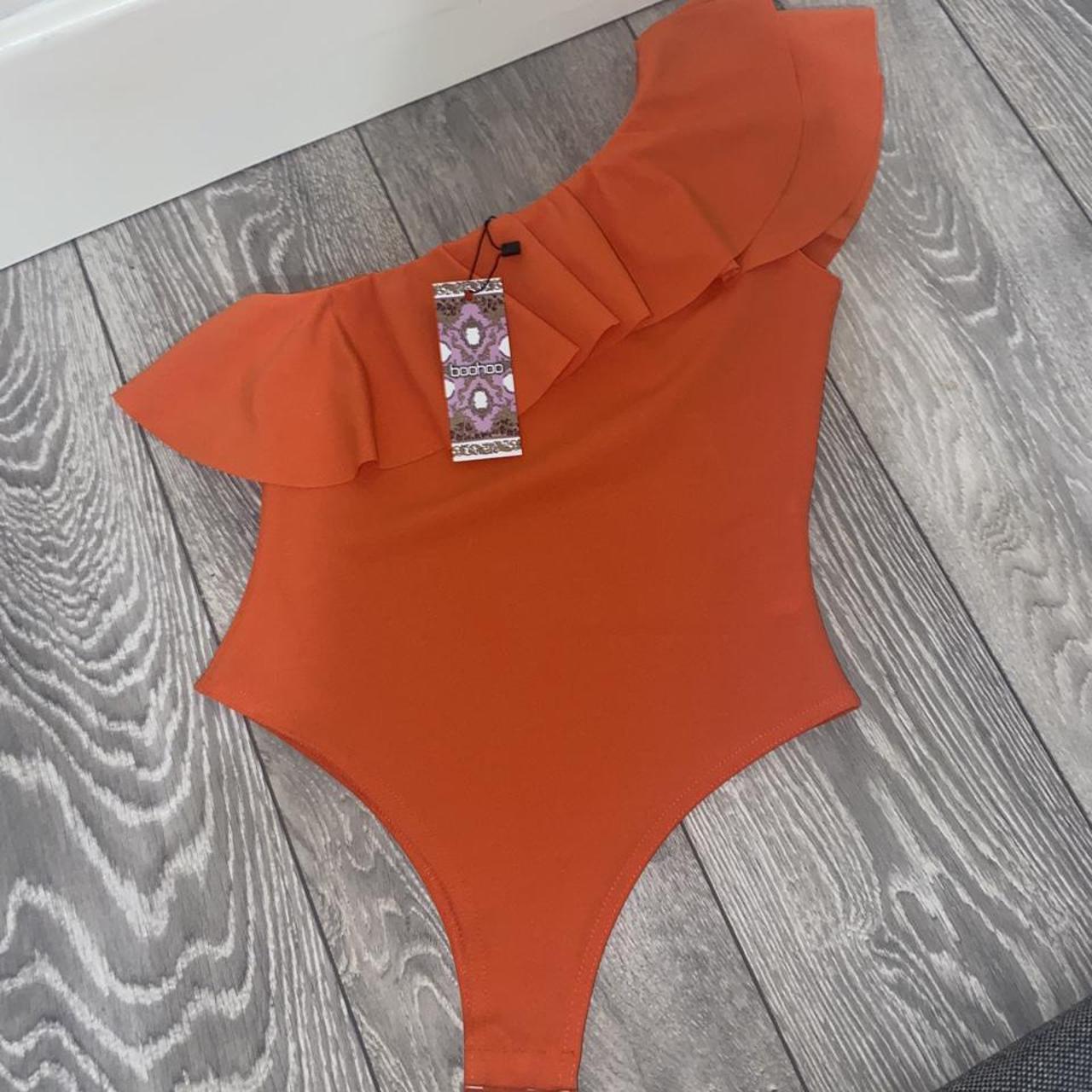 Boohoo orange frill top bodysuit with poppers Brand... - Depop