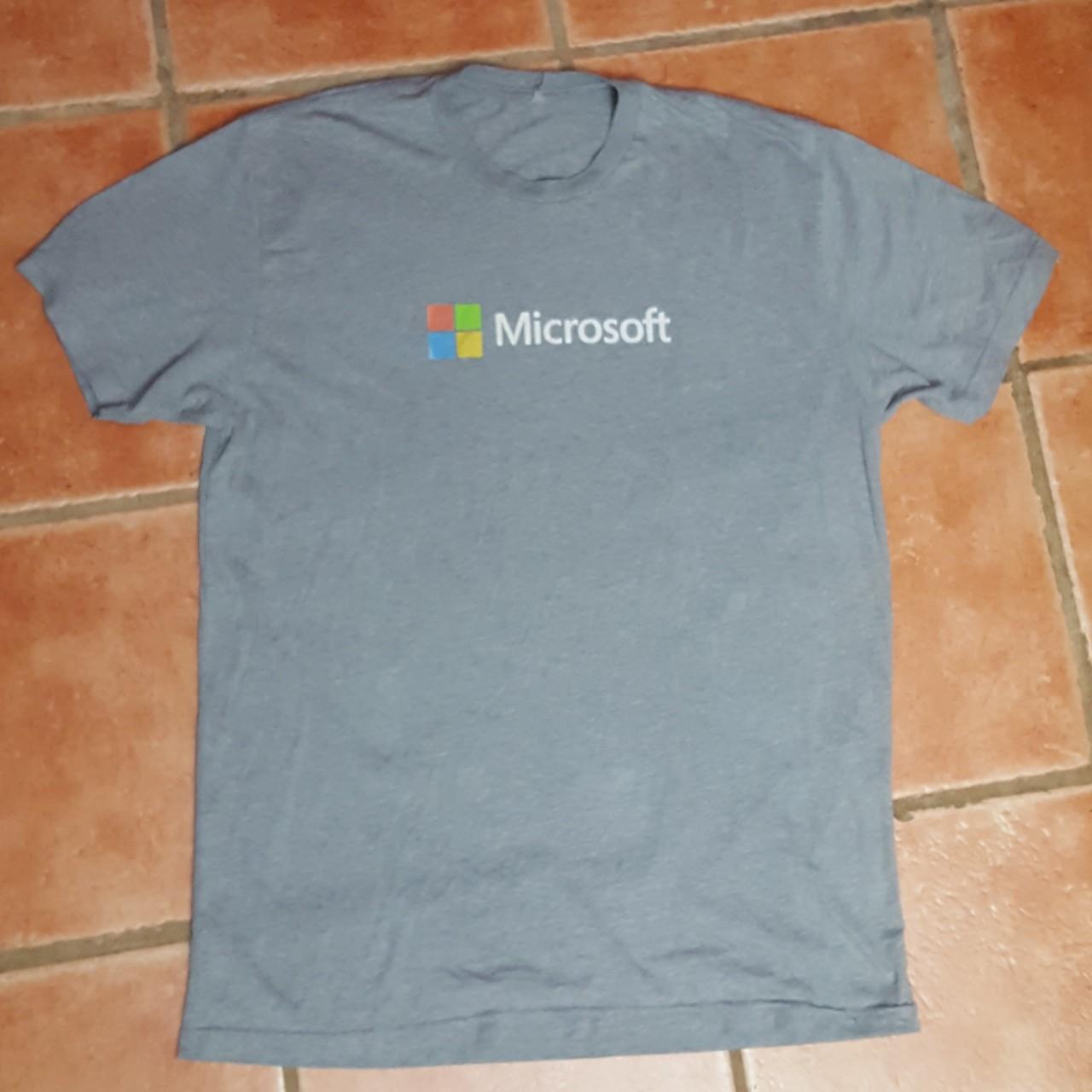 This vintage Microsoft tshirt features a soft grey... - Depop