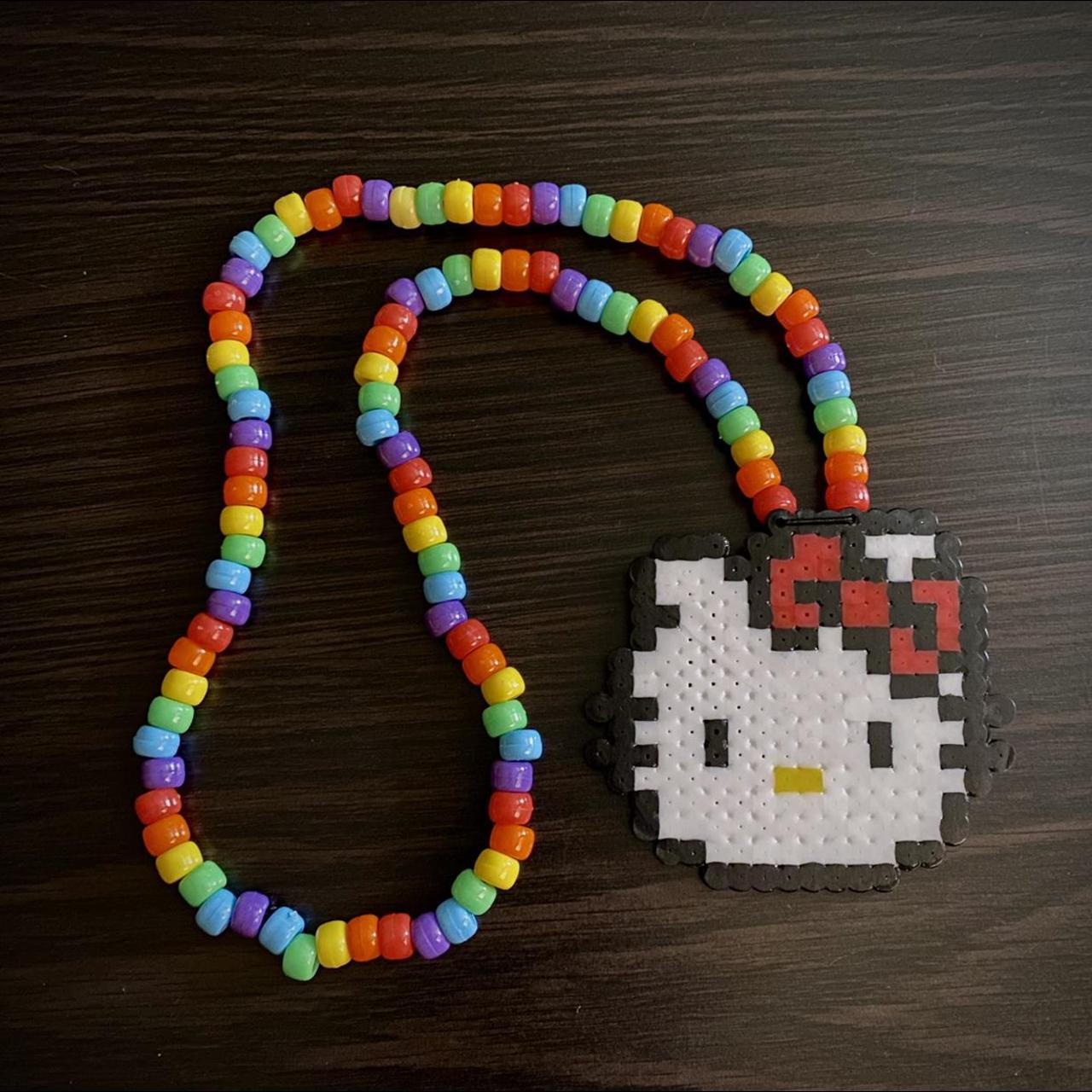Hello Kitty rave necklace I made:)) It is very cute... - Depop