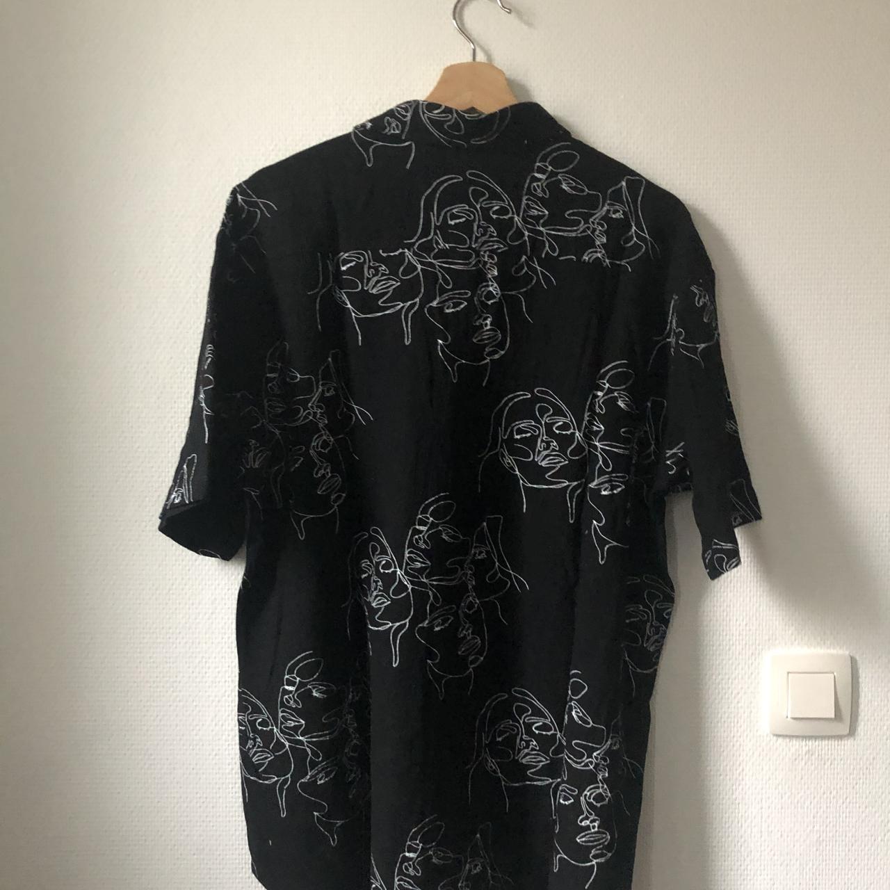For sale, a black face shirt from Junmanner Homme in... - Depop