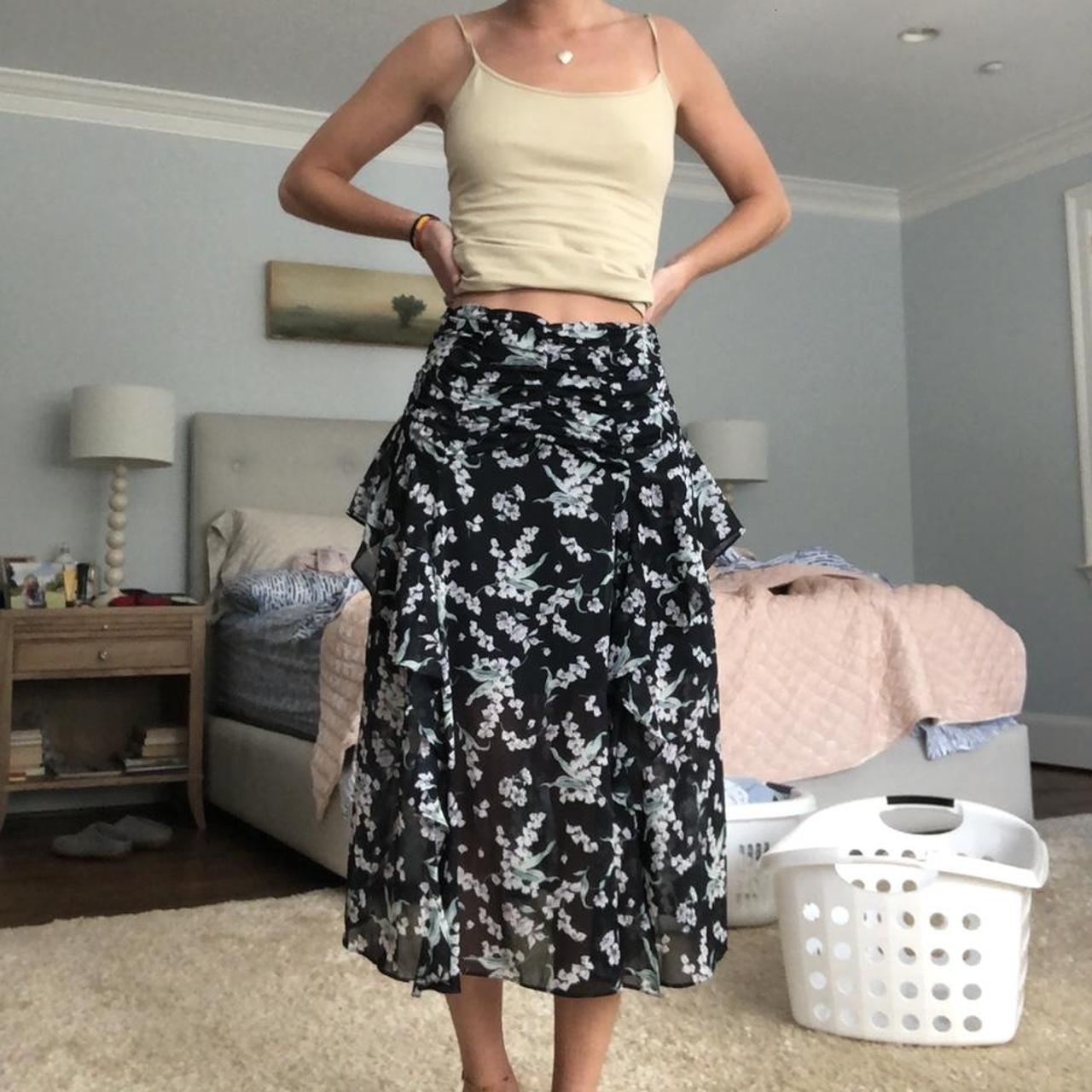 Elliat floral navy midi skirt with a zip closure in... - Depop