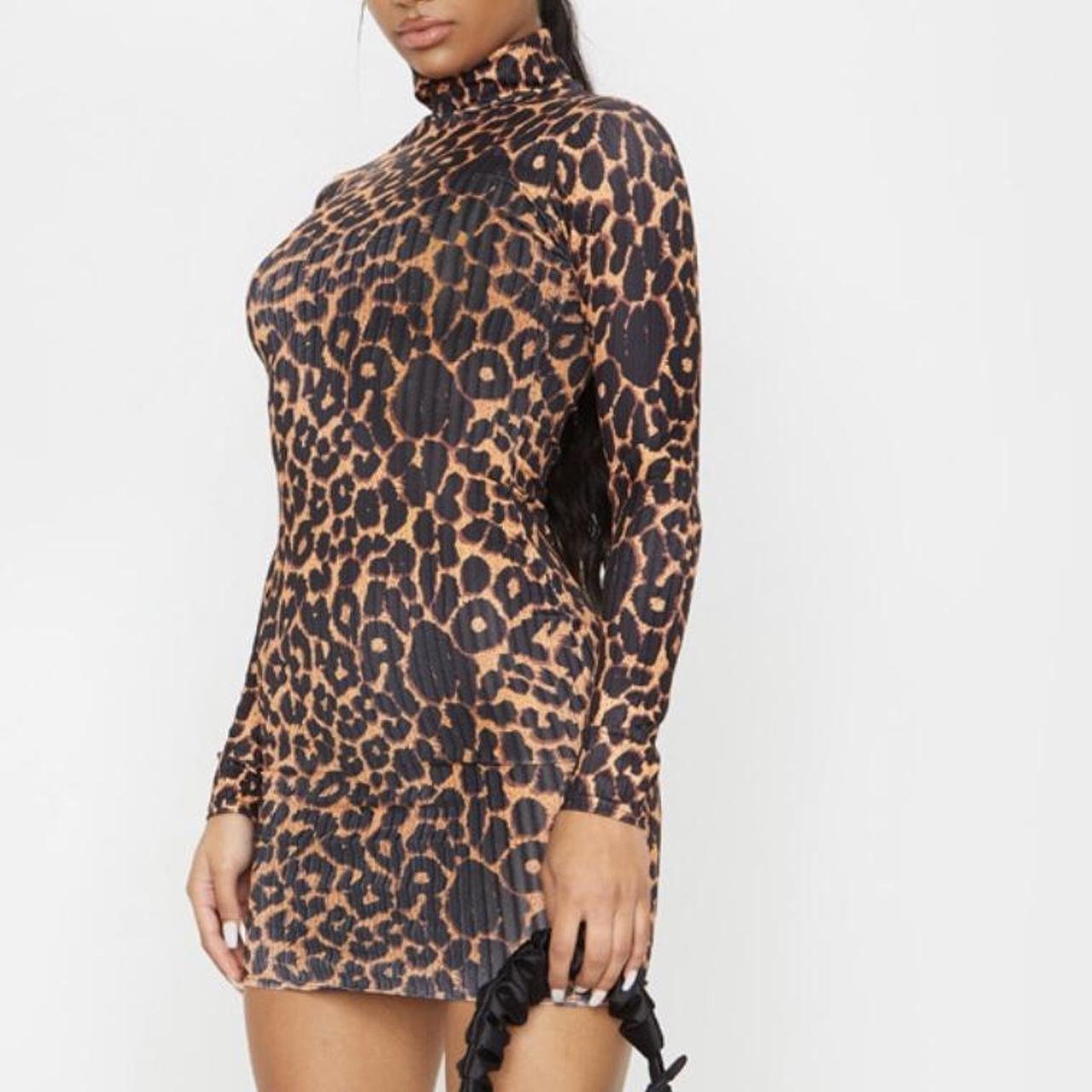 Black leopard print body con dress, worn but in... - Depop