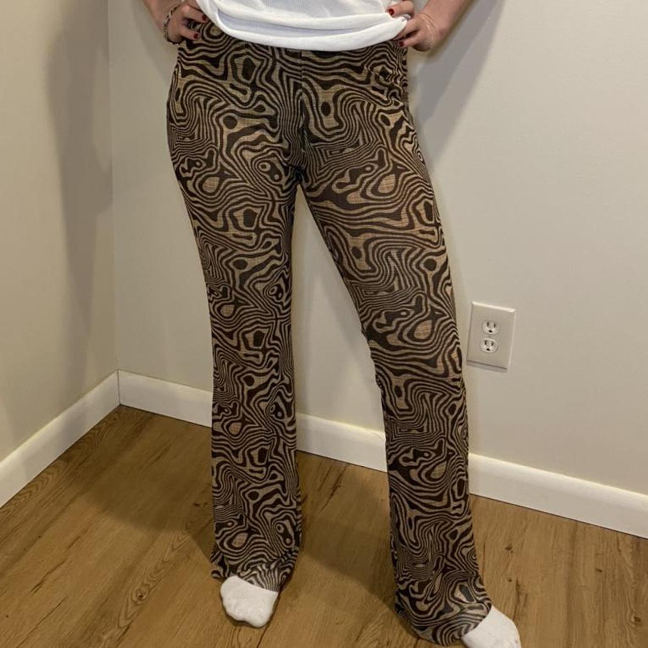 psychedelic swirly patterned flare pants. tan and... - Depop