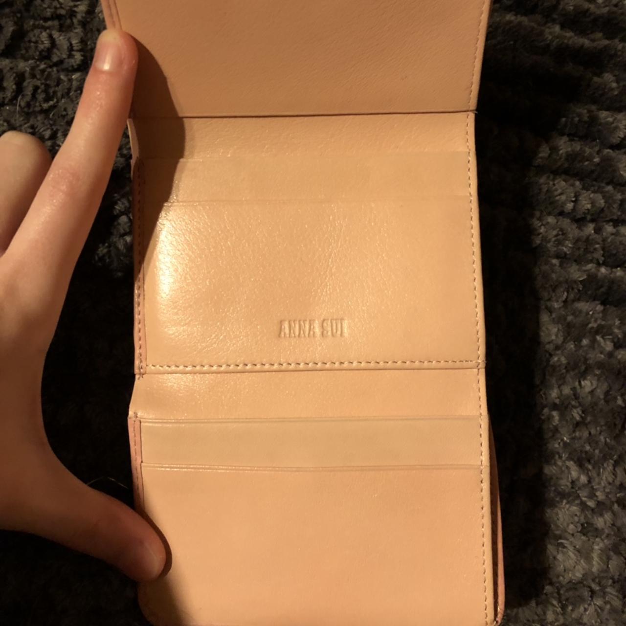 light scuffing/wear on the back. small leather... - Depop