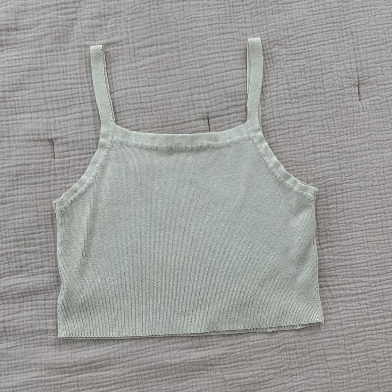 Pale yellow tank from brandy Melville- has some wear... - Depop