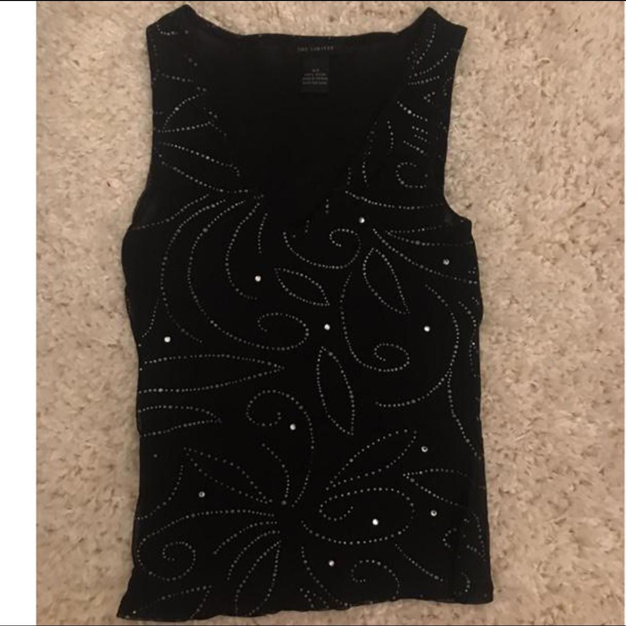 The limited black v-cut tank top with sparky designs... - Depop