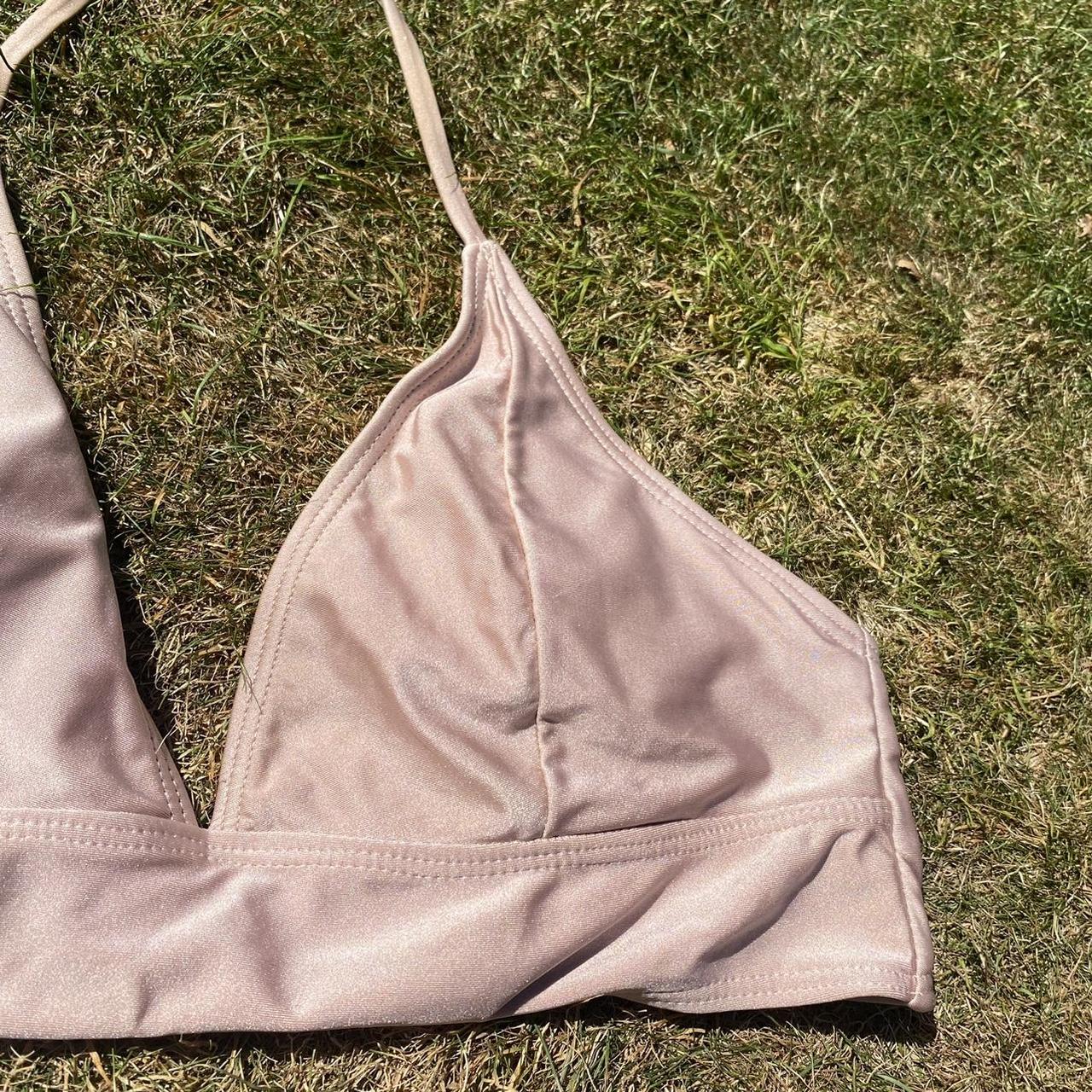 Pink bikini top with halter neck tie and a clasp at... - Depop