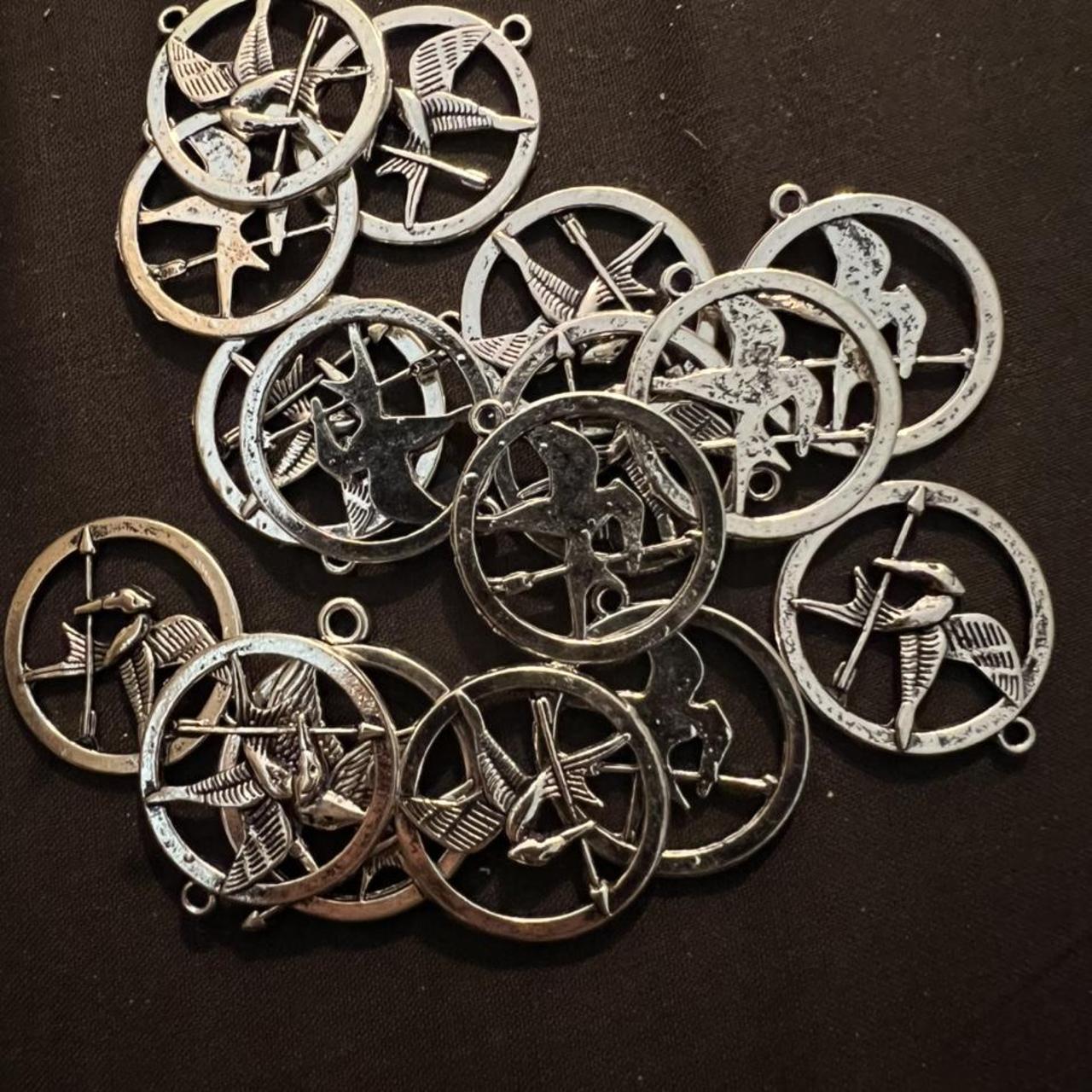 Mockingbird hunger games silver tone charms x... - Depop