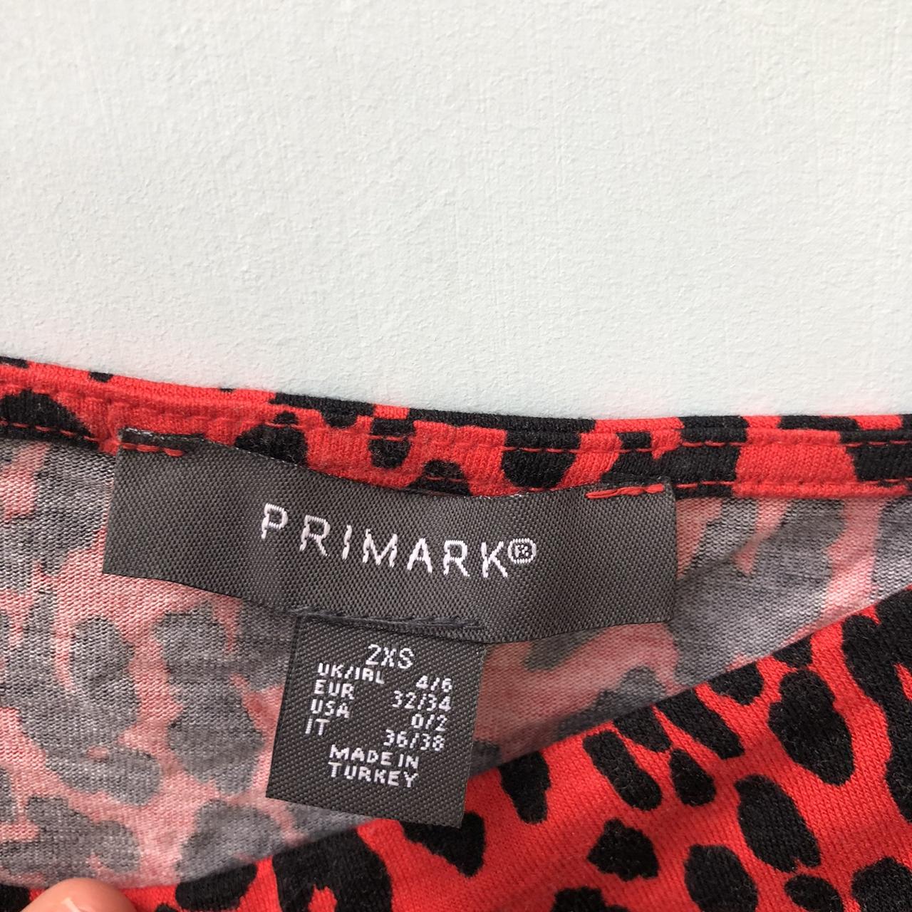 Red animal print cropped cami, double lined front... - Depop