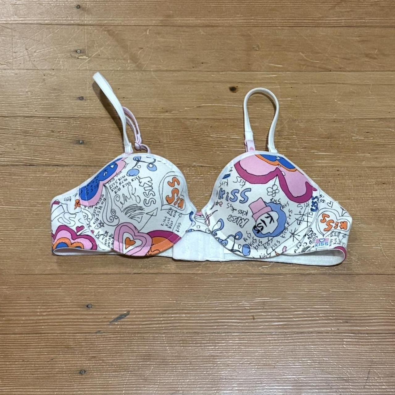 Multi-coloured bra with cute design fits like... | Depop