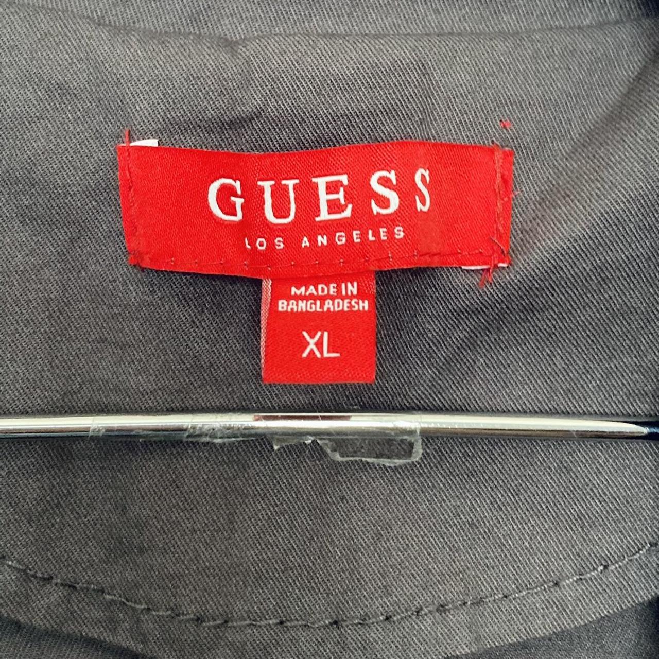 Dark grey cropped Guess jacket. Silver buttons and... - Depop